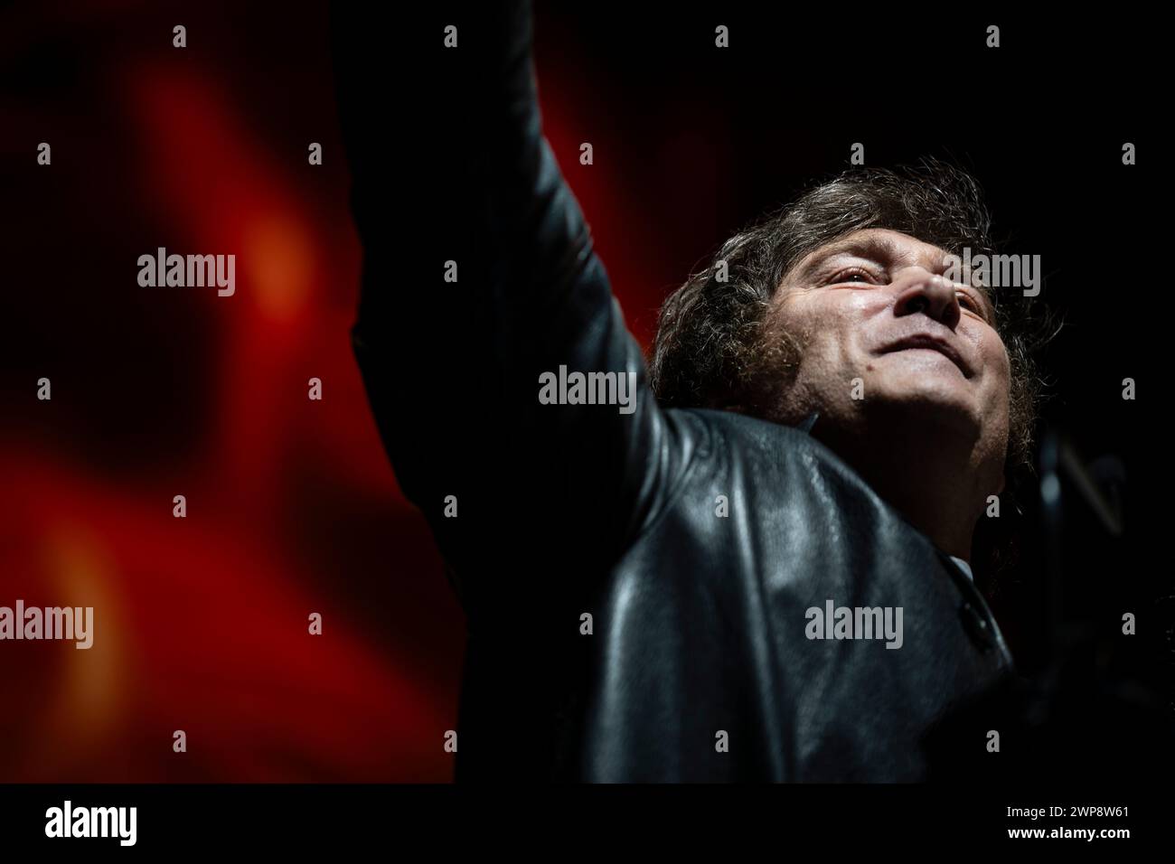 Javier Milei greets the audience during his campaign closing ceremony ...