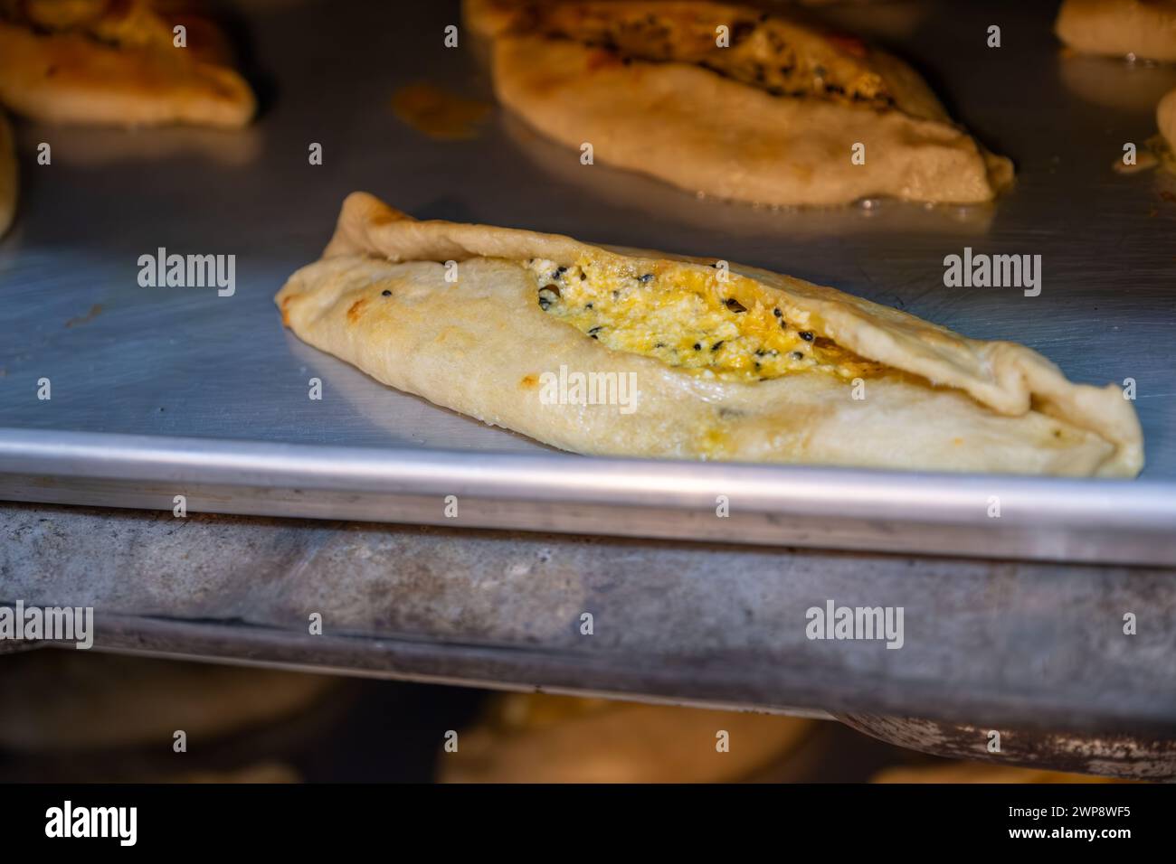 Pastries in oven being baked and freshly made of flour, olive oil and ...
