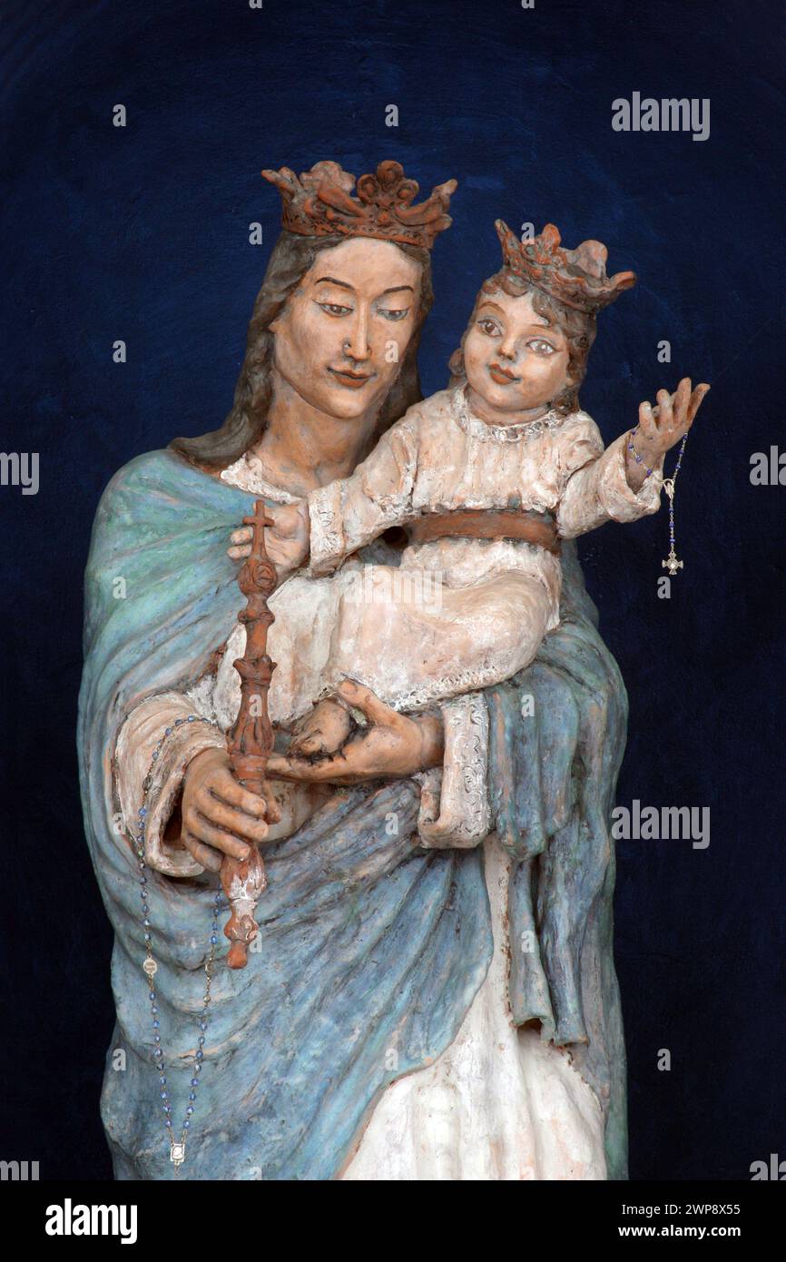 Virgin Mary with baby Jesus, statue on the high altar in the parish ...