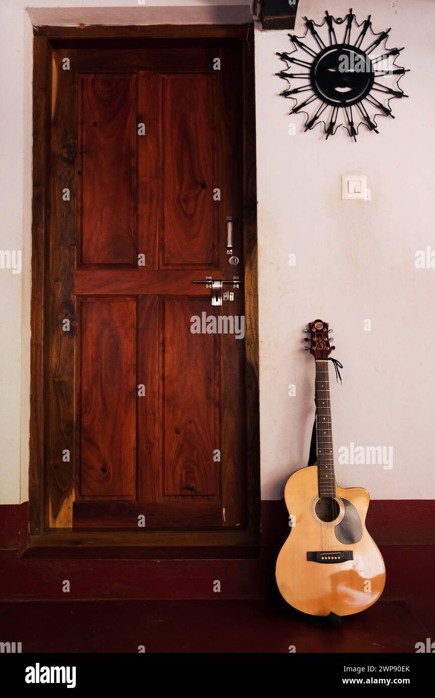 Interior of a house with guitar and decorative items arranged to the ...