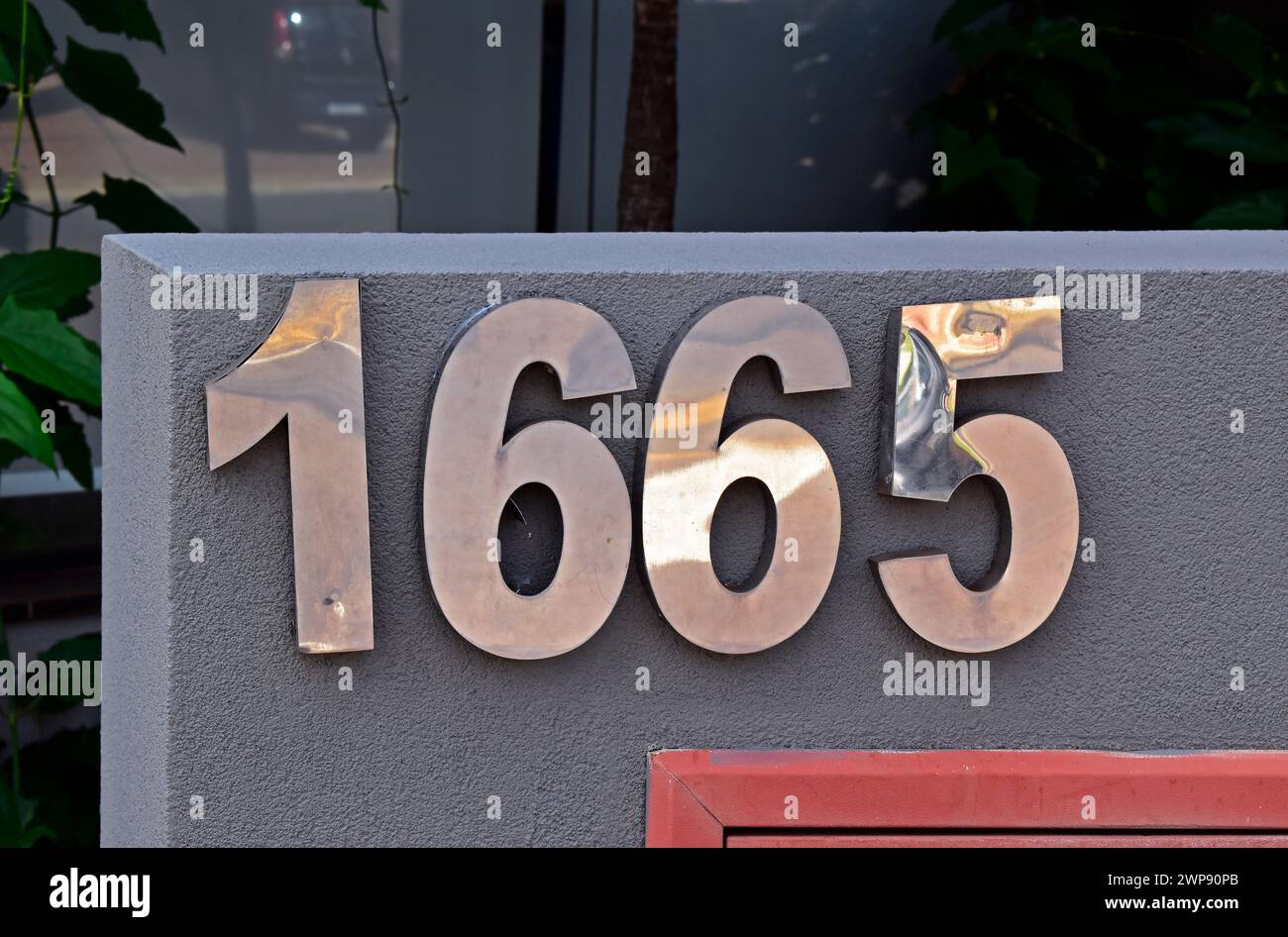 Street sign number 1665 on a building facade Stock Photo - Alamy