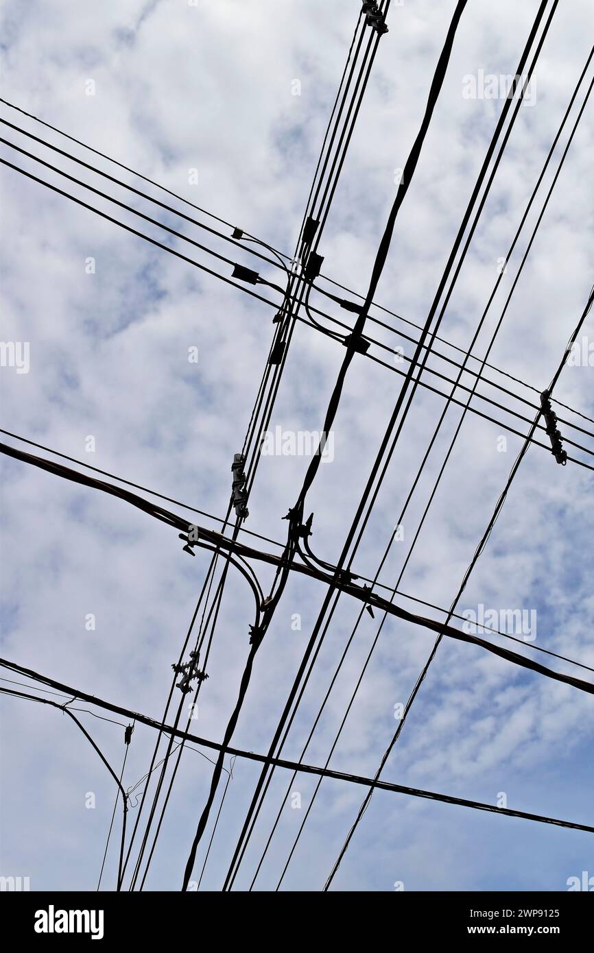 Electrical wires crossing and blue sky in Ribeirao Preto, Sao Paulo ...