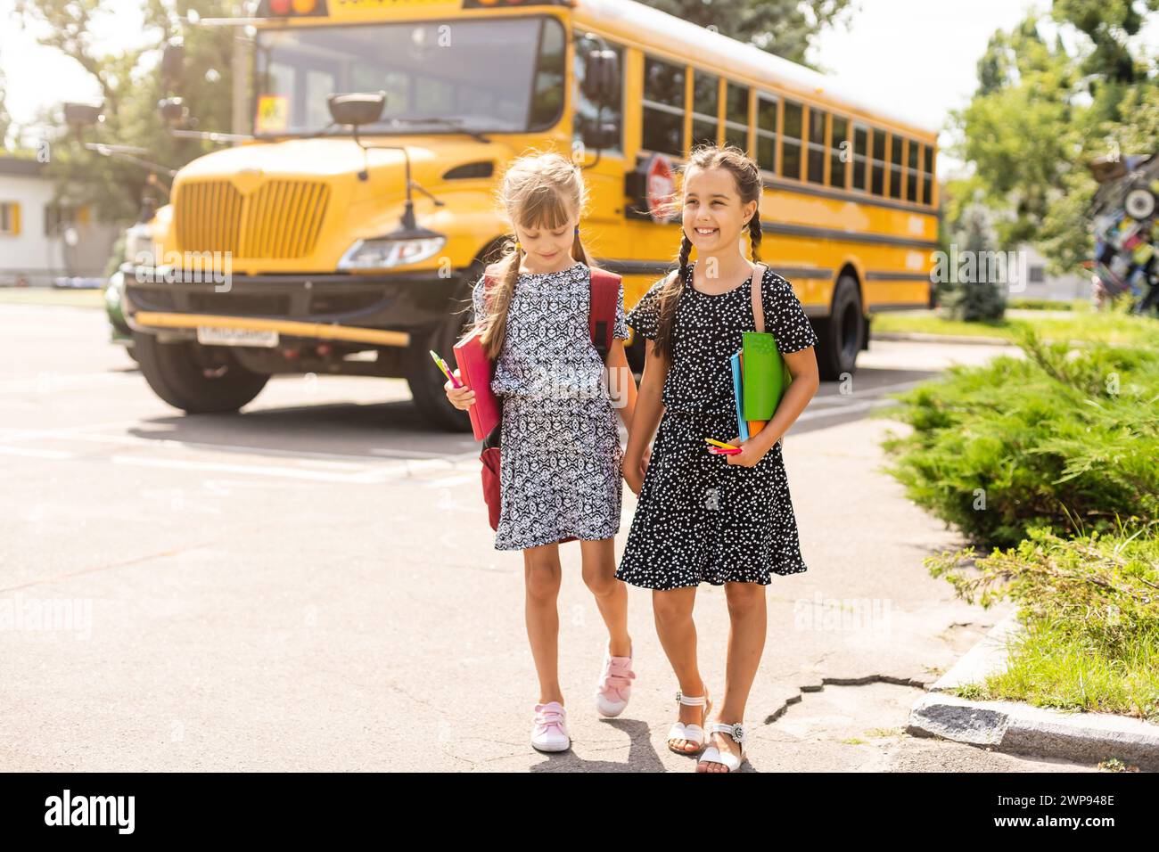 Basic school students crossing the road Stock Photo - Alamy