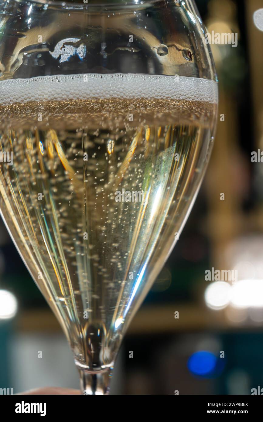 Glass with little bubbles, tasting of sparkling wine champagne on ...