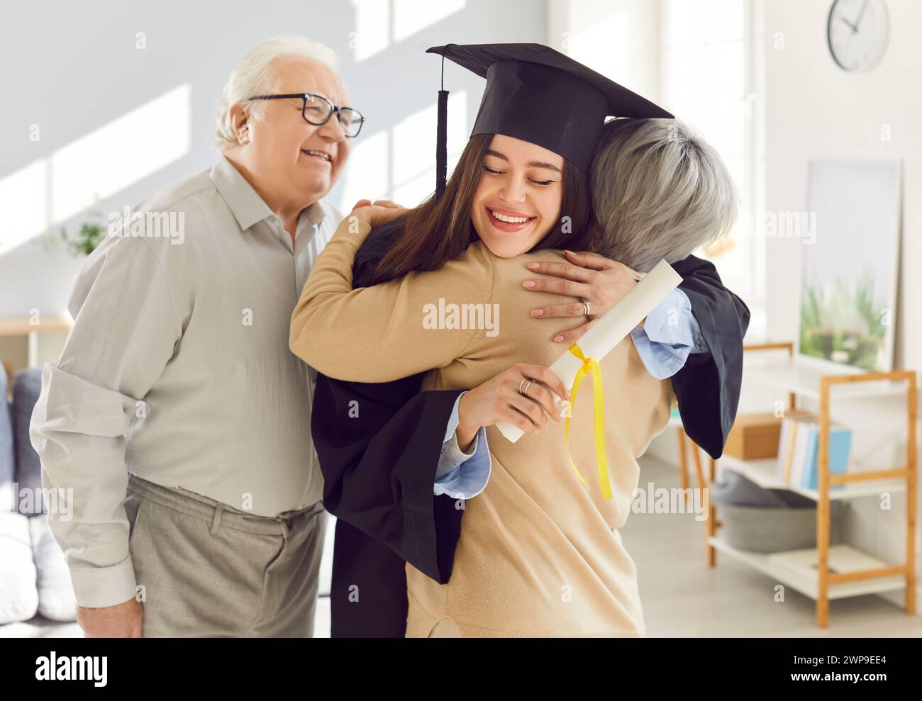 Mother father daughter graduation hi-res stock photography and images ...