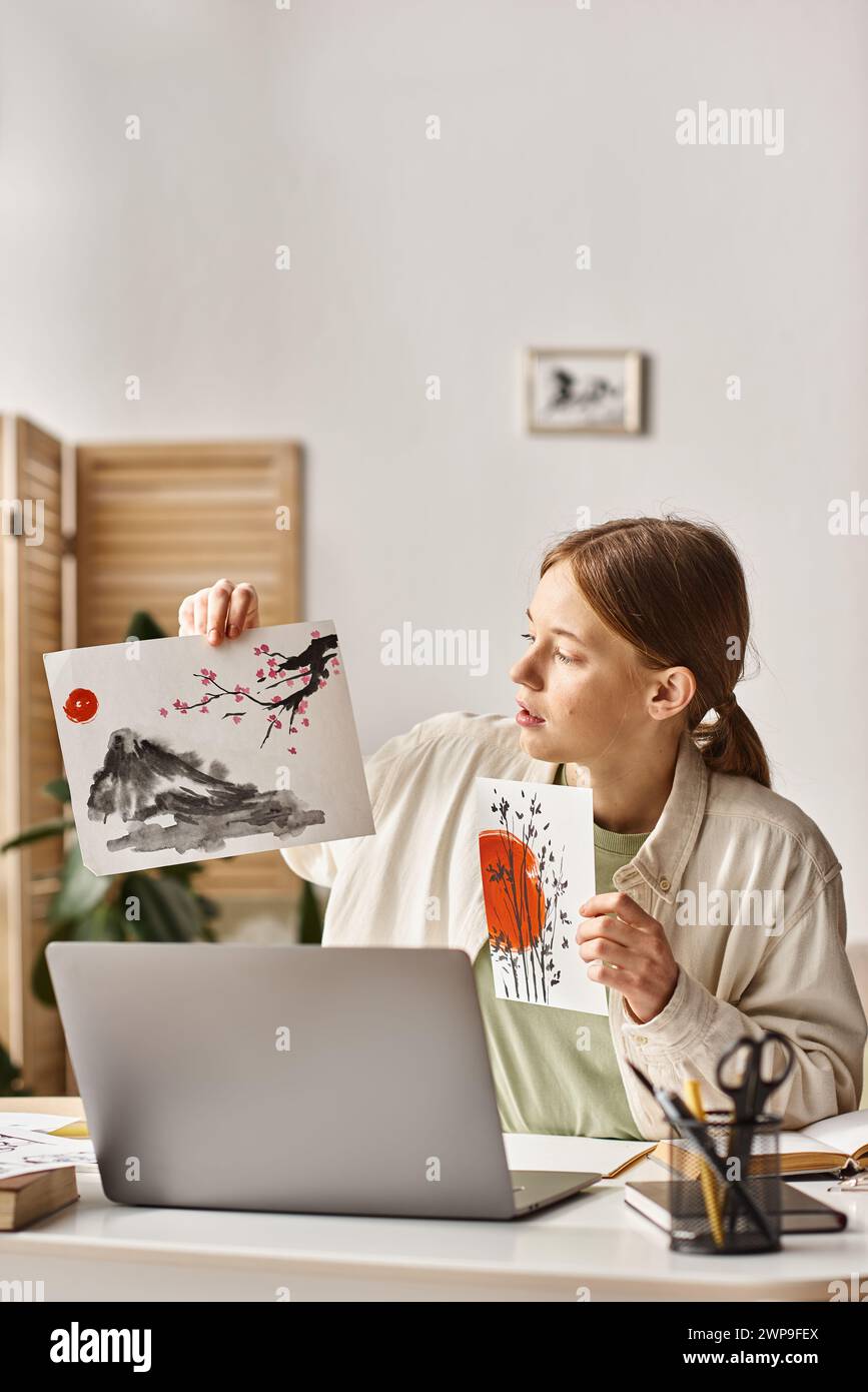 Teenage student showing her artwork while studying and looking at her ...