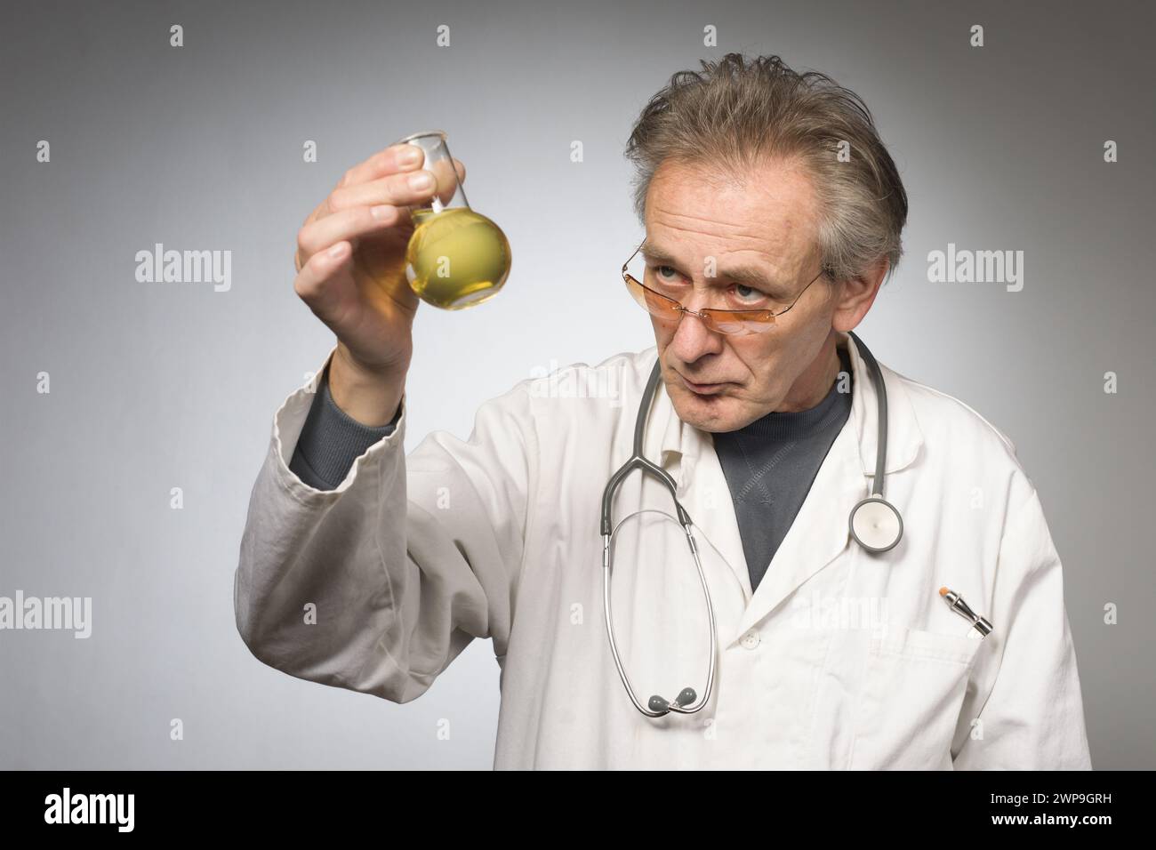 Doctor practicioner in traditional retro medical gown determining ...