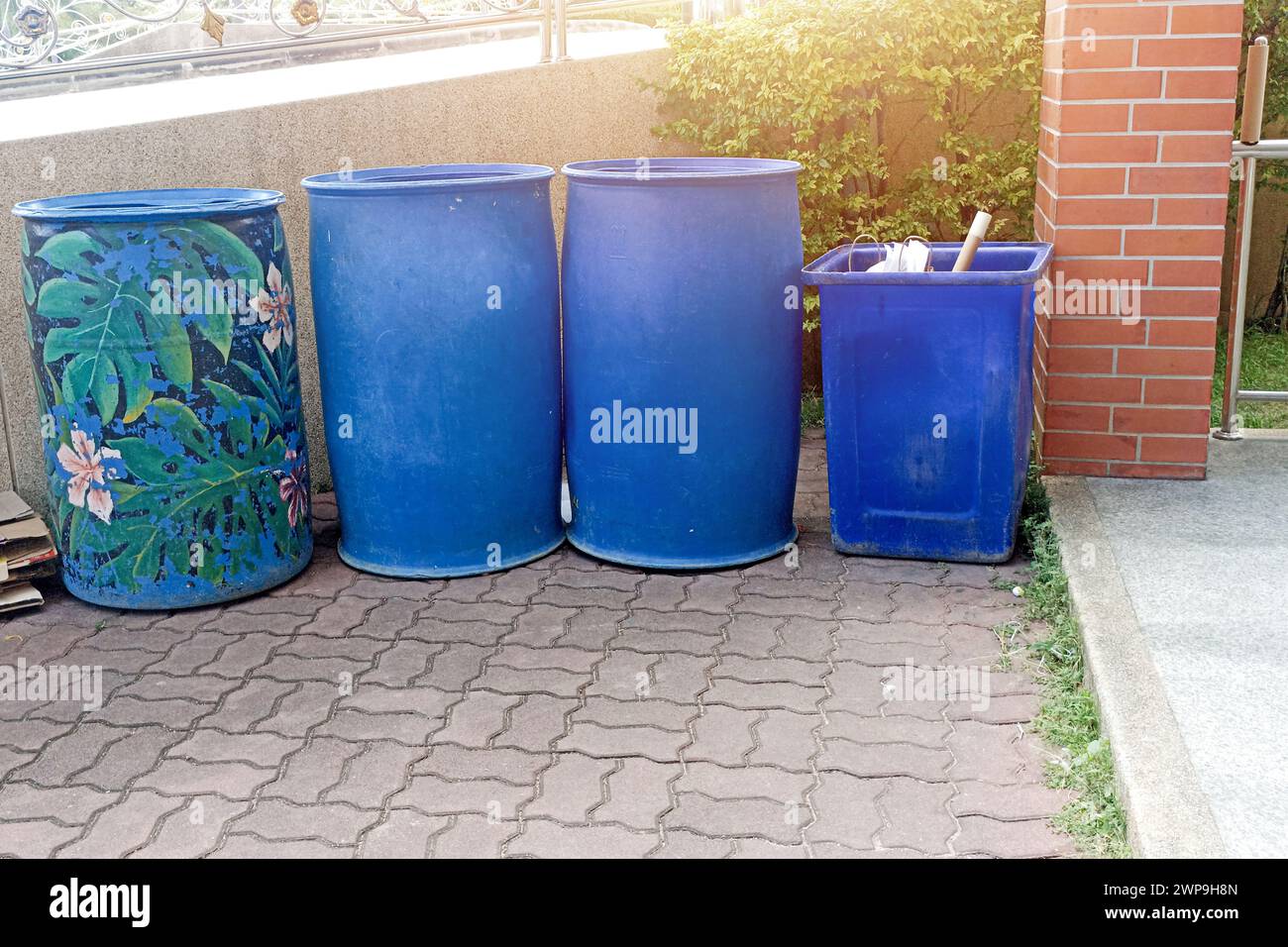 blue garbage bin Cylindrical and square, 4 pieces Stock Photo - Alamy