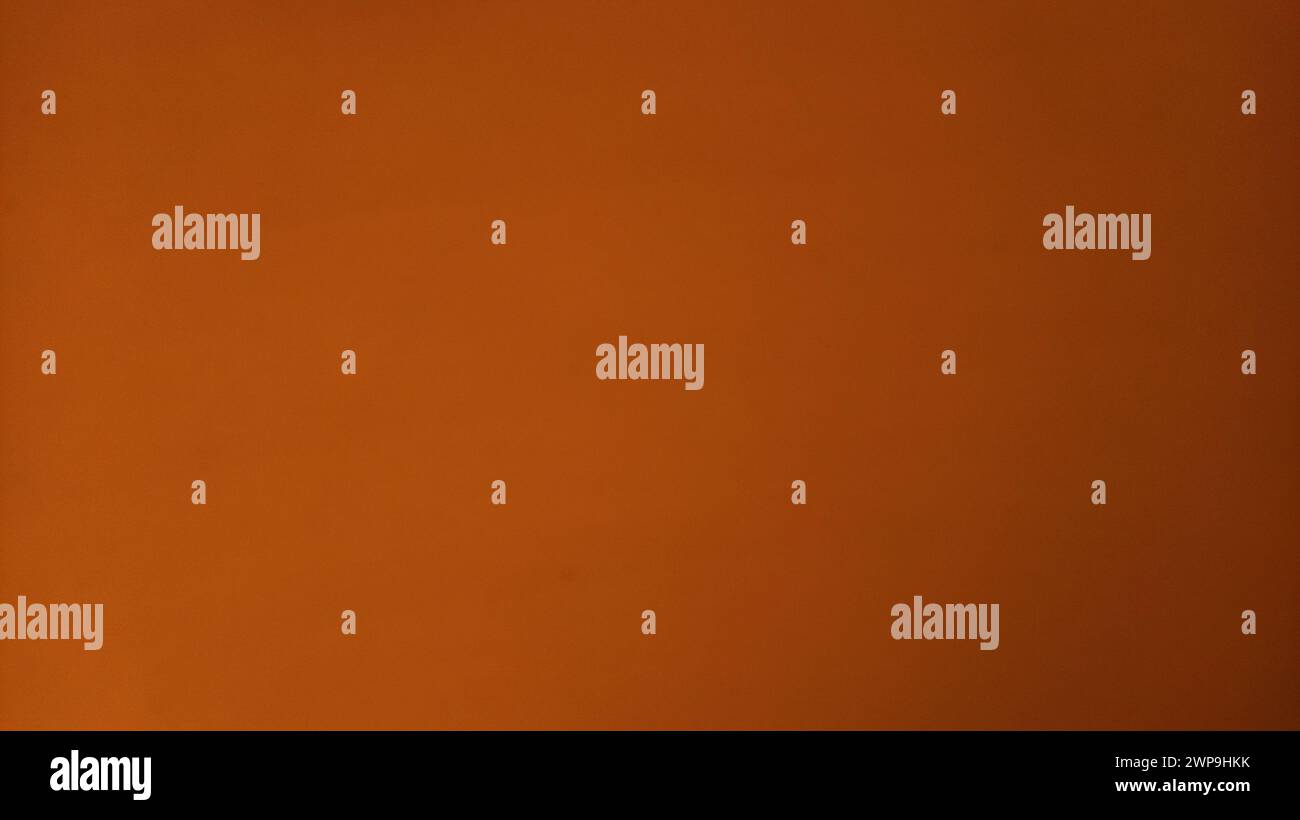 Dark saturated orange paper with a transition from light orange to ...