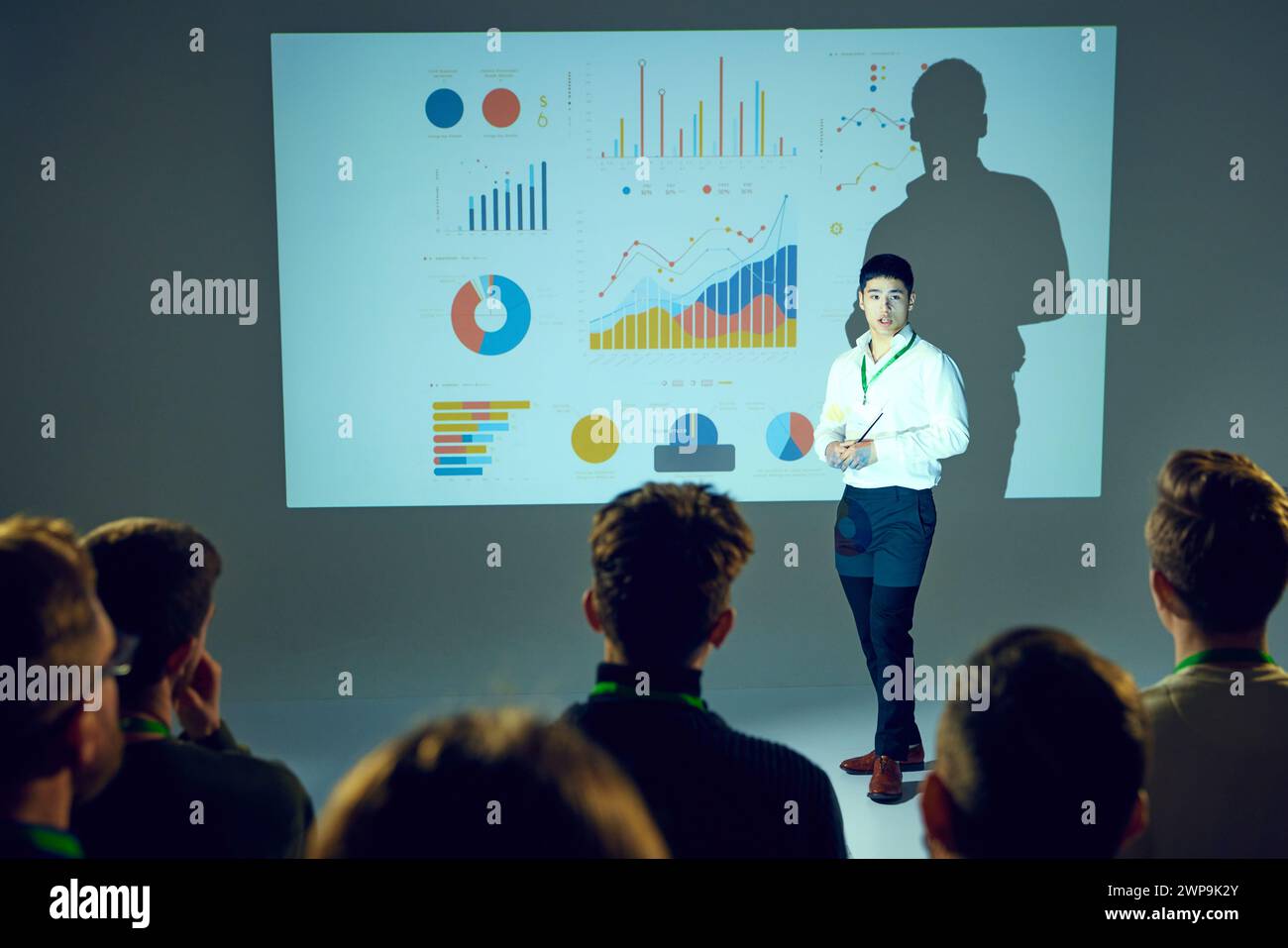 Asian man, businessman lecturing at business seminar with attendees ...