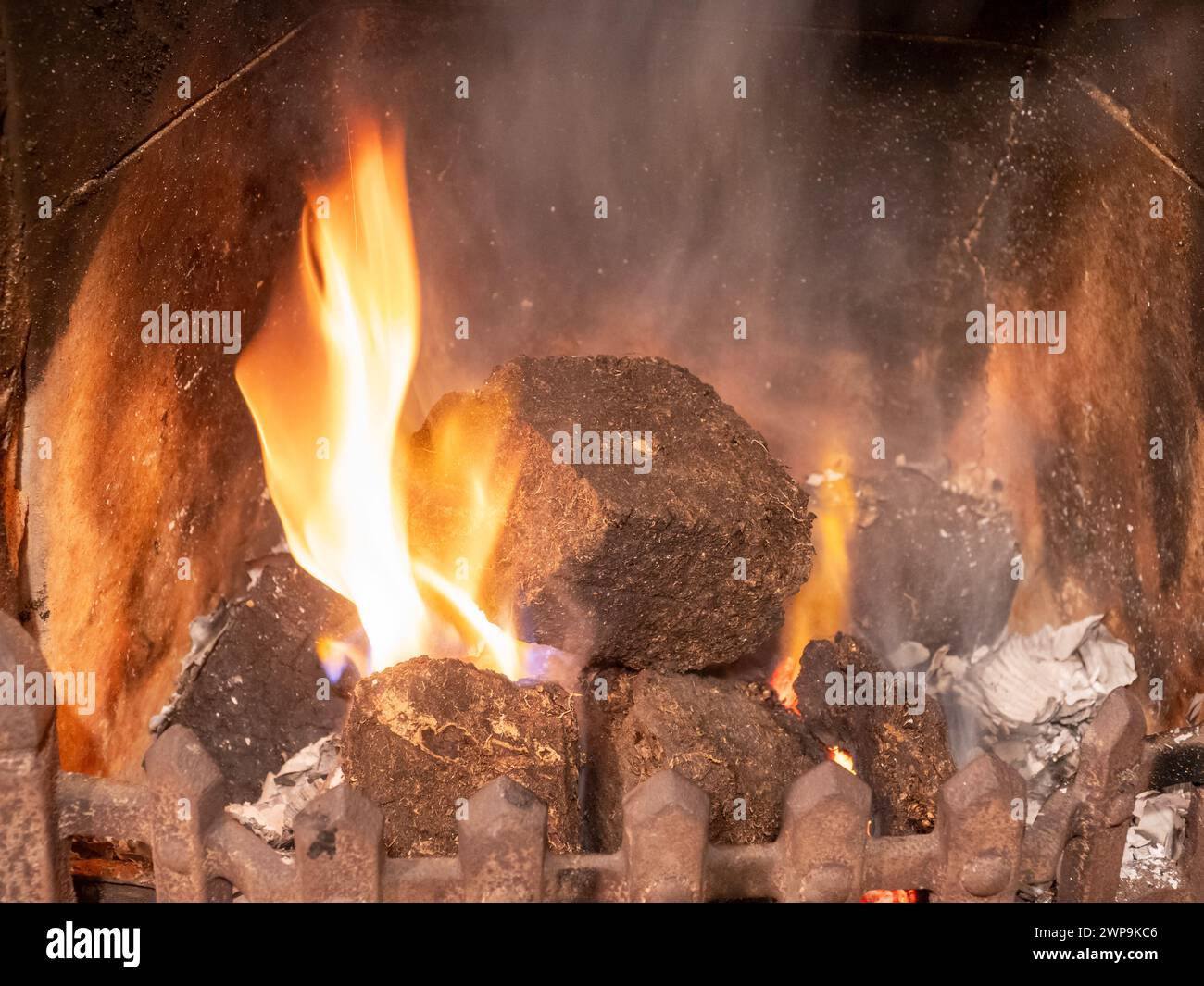 Peat being used as fuel on a house fire in Portnahaven on Islay ...