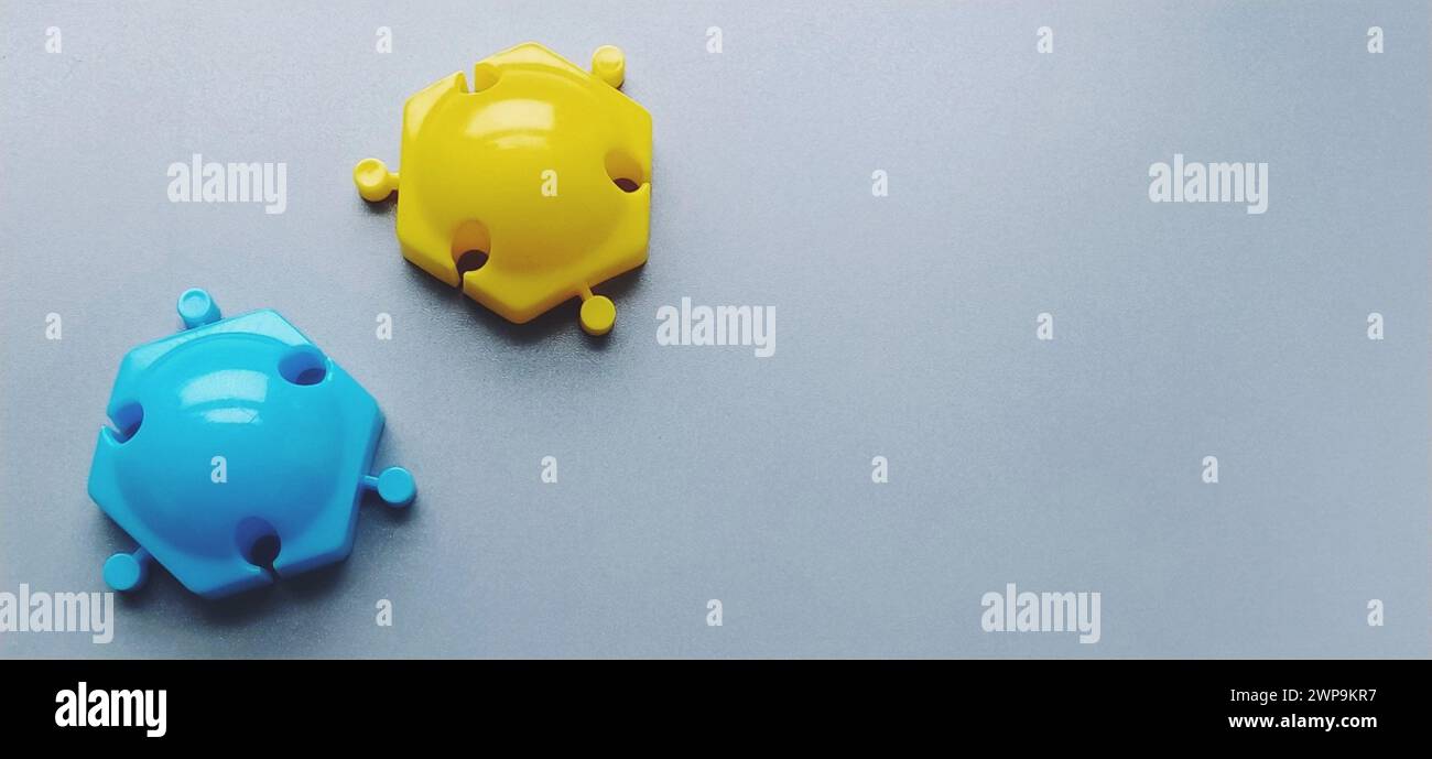 Multi-colored details from the childrens designer on a gray background ...