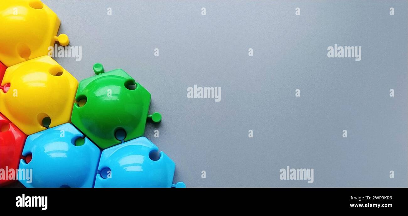 Multi-colored details from the childrens designer on a gray background ...