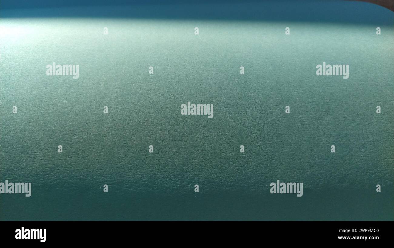 A sheet of light green paper with vignetting at the bottom. Calm green ...