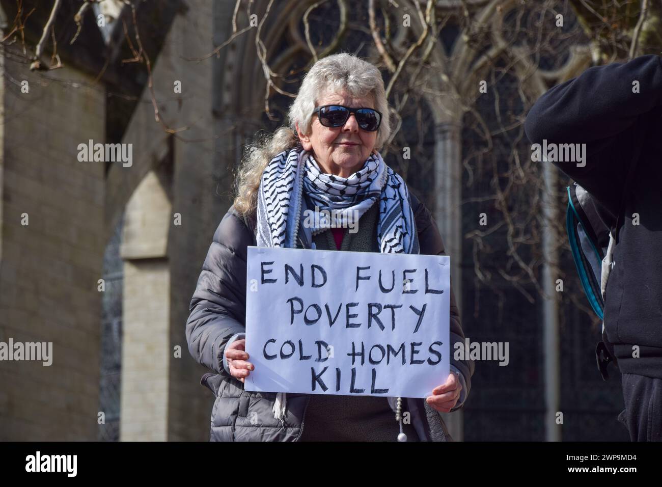 London, UK. 06th Mar, 2024. A protester holds an 'End fuel poverty ...