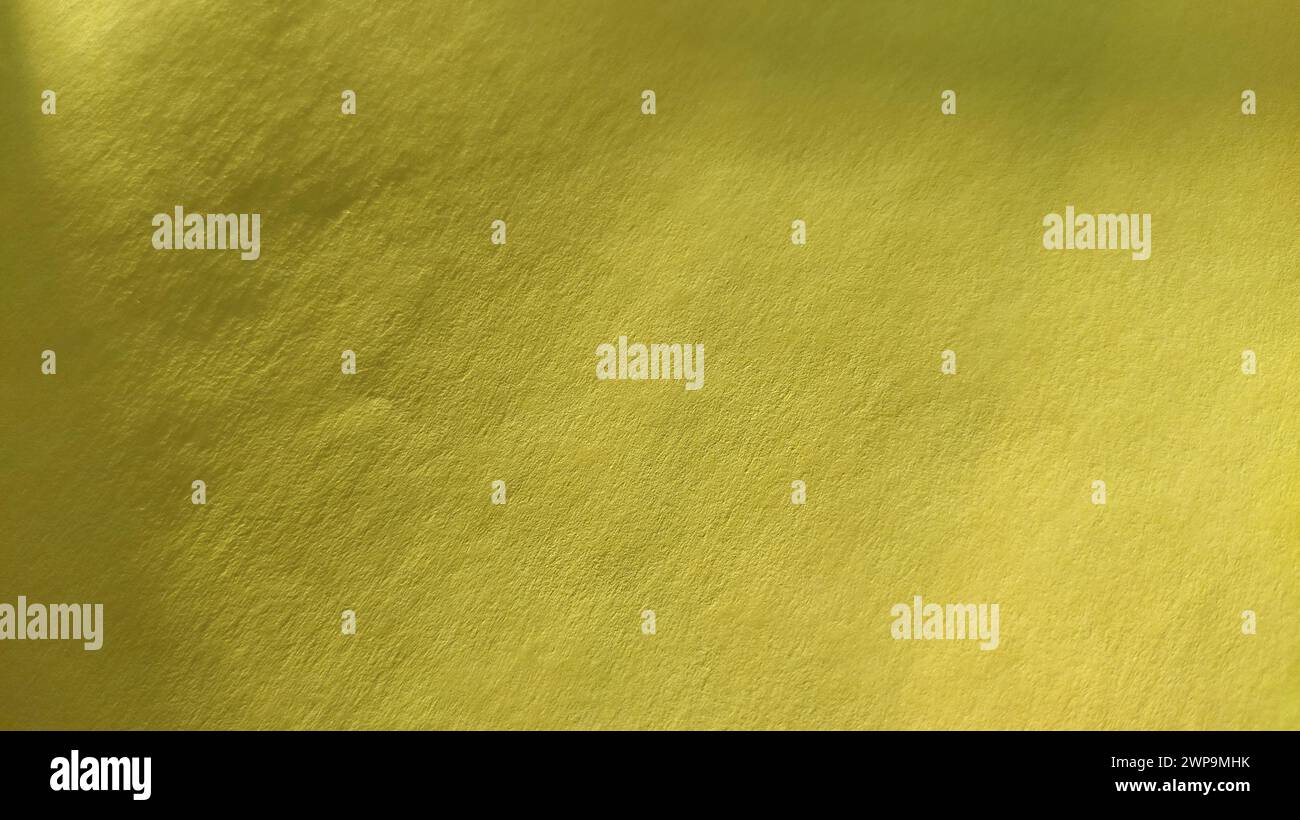 The paper or fabric material is bright yellow. Close-up. Slightly ...