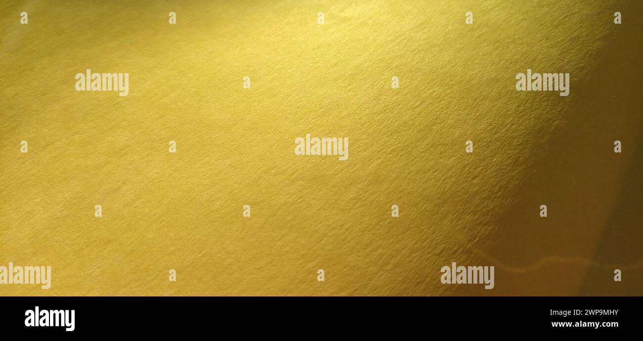 The paper or fabric material is bright yellow. Close-up. Slightly ...