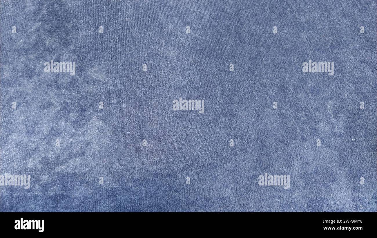 Blue velvet fabric. Dense, pleasant to the touch curtains close-up ...