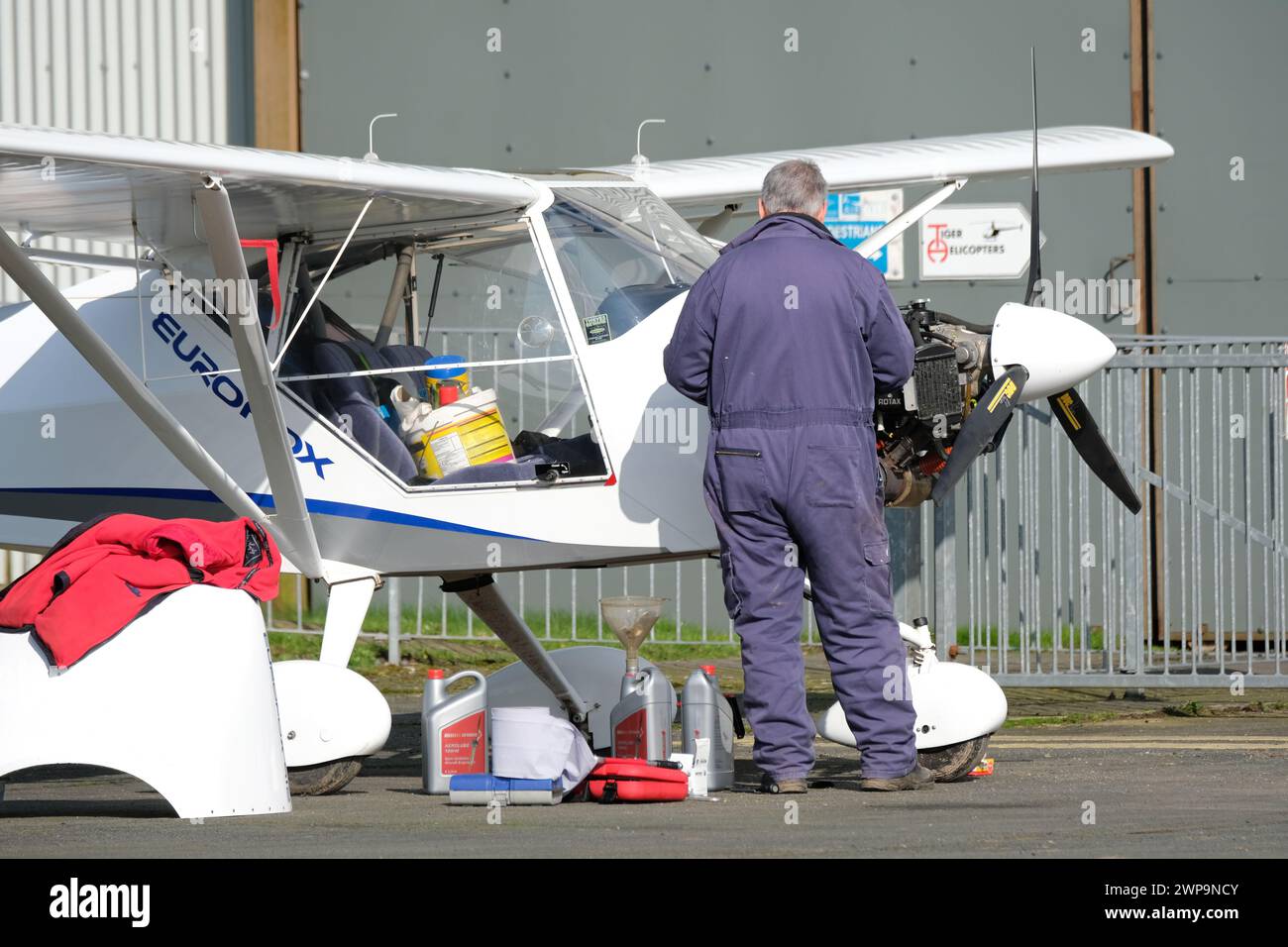 Light aircraft general aviation maintenance working on a Eurofox ...
