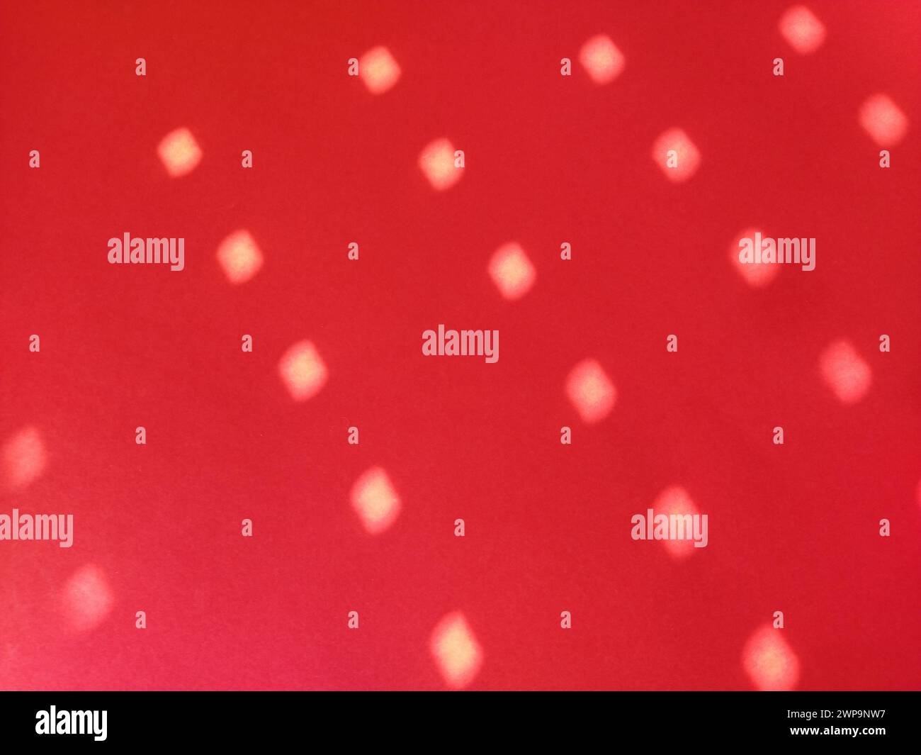 Red background with polka dots. Rays of the sun shining through the ...