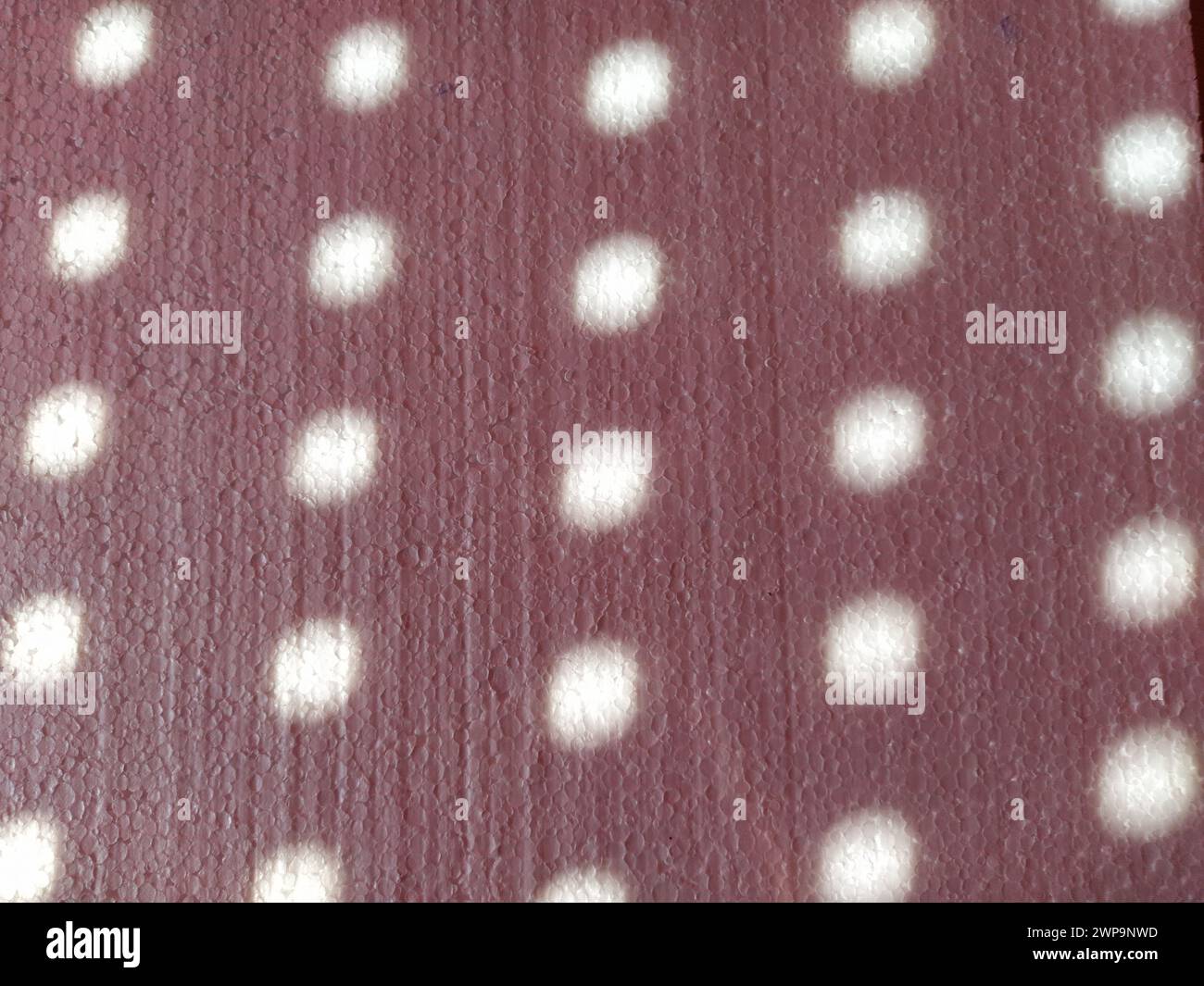 Red background with polka dots. Rays of the sun shining through the ...