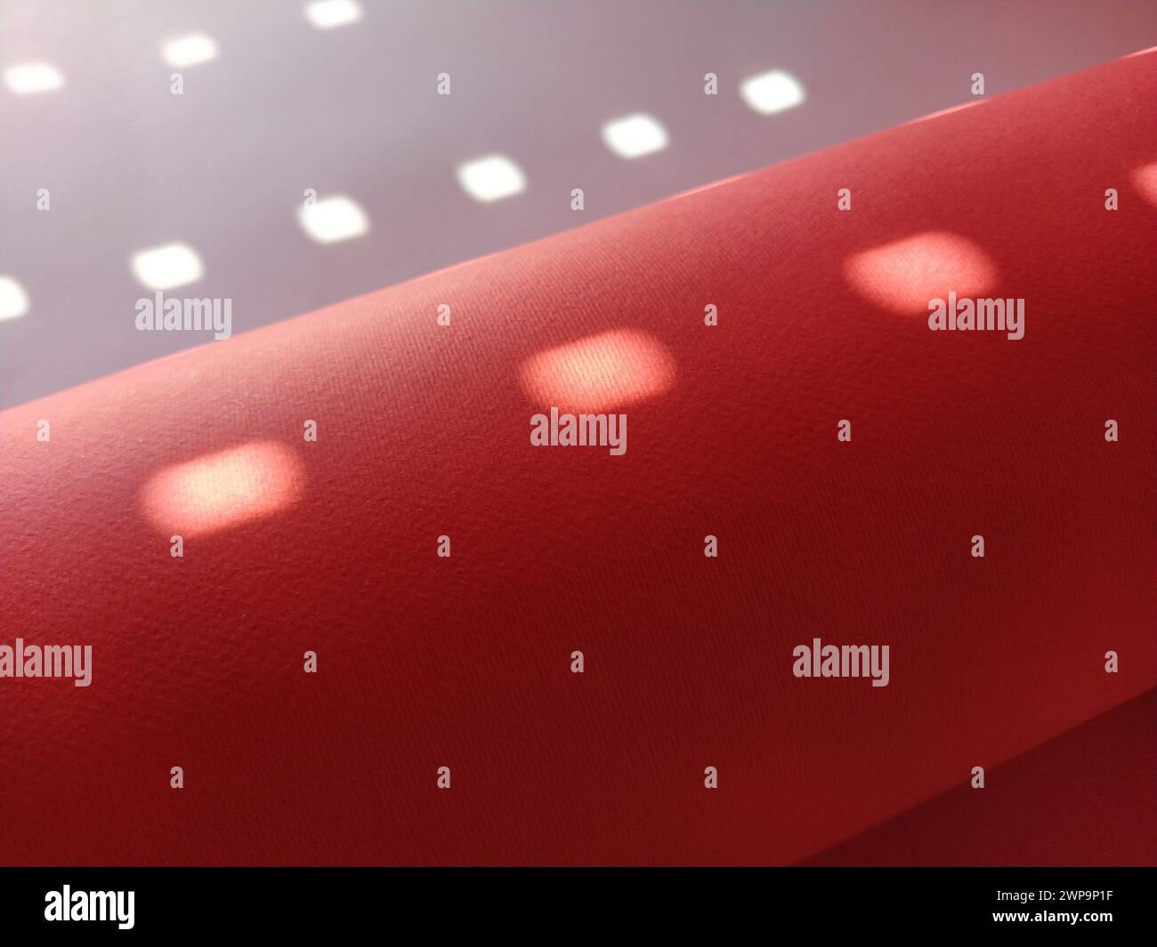 Red background with polka dots. Rays of the sun shining through the ...