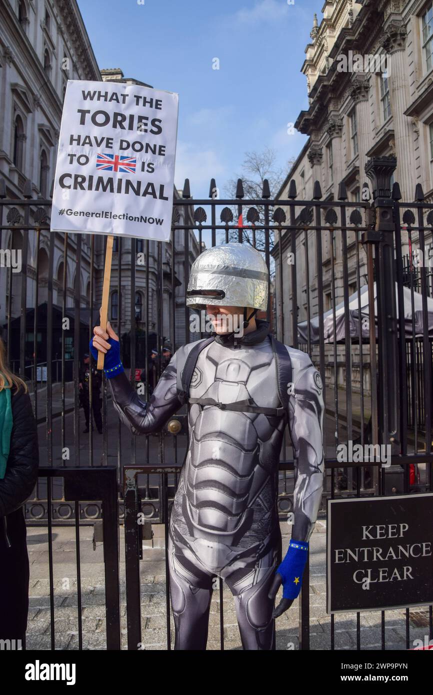 London, England, UK. 6th Mar, 2024. An anti-Tory protester wearing a ...