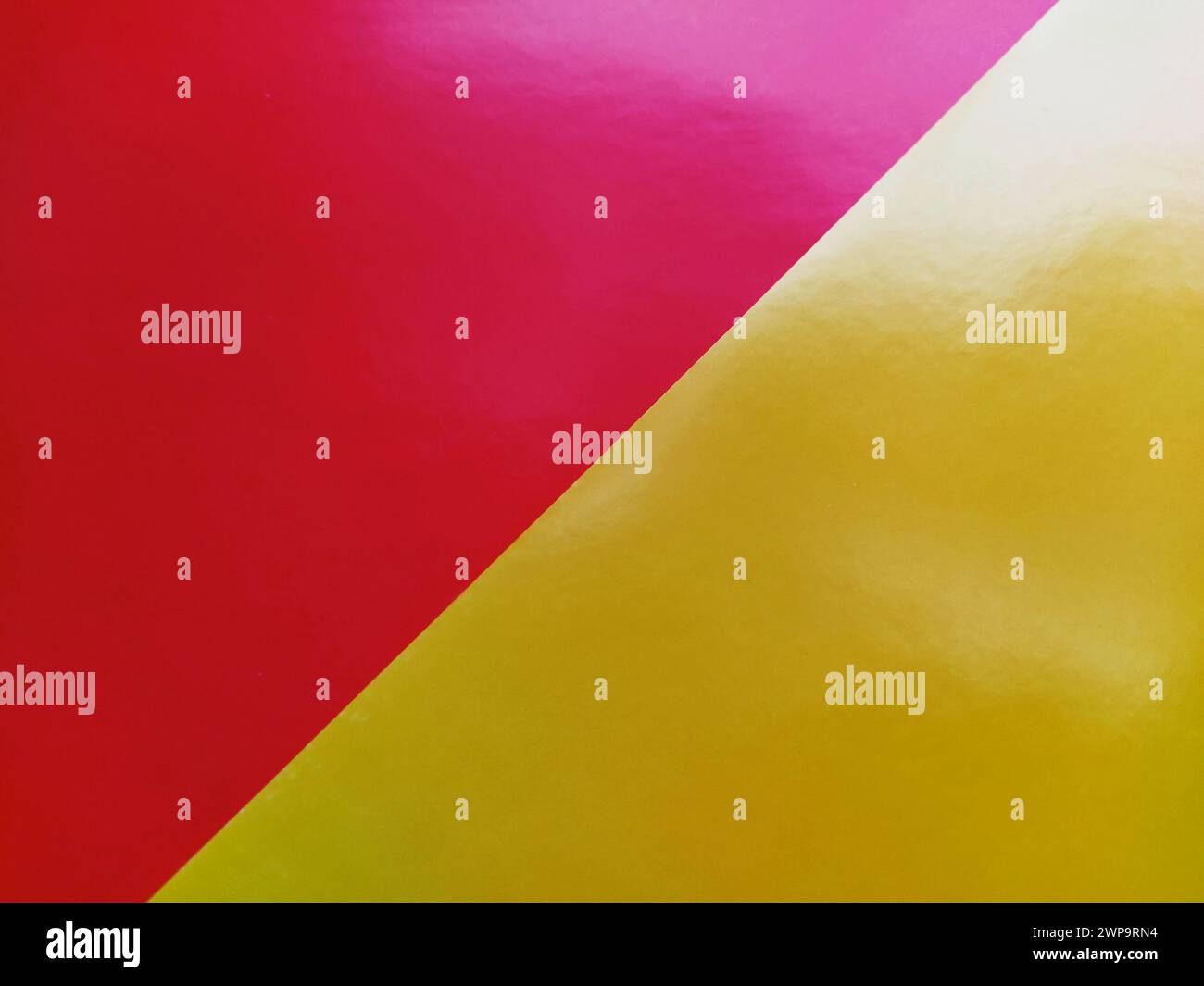 Yellow-pink bright background. Diagonally laid sheets of colored paper ...