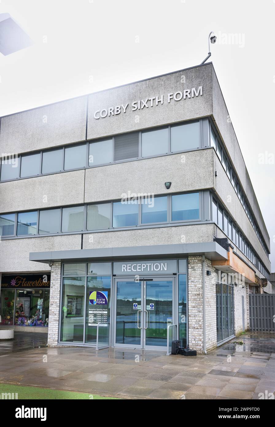 Sixth Form college at Corby town shopping centre on a rainy winter day ...