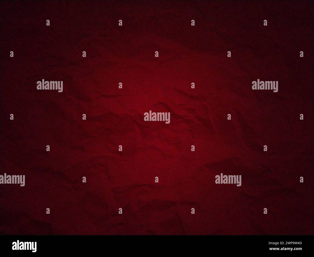 Dark red background with uneven spots and vignetting. Crumpled thick ...