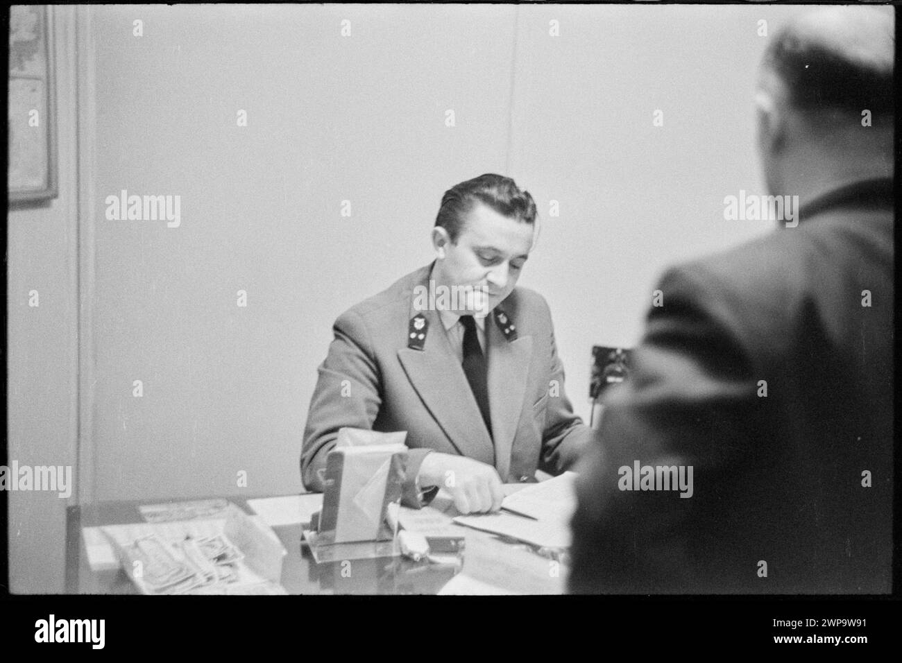 Customs officer performing passport Black and White Stock Photos ...