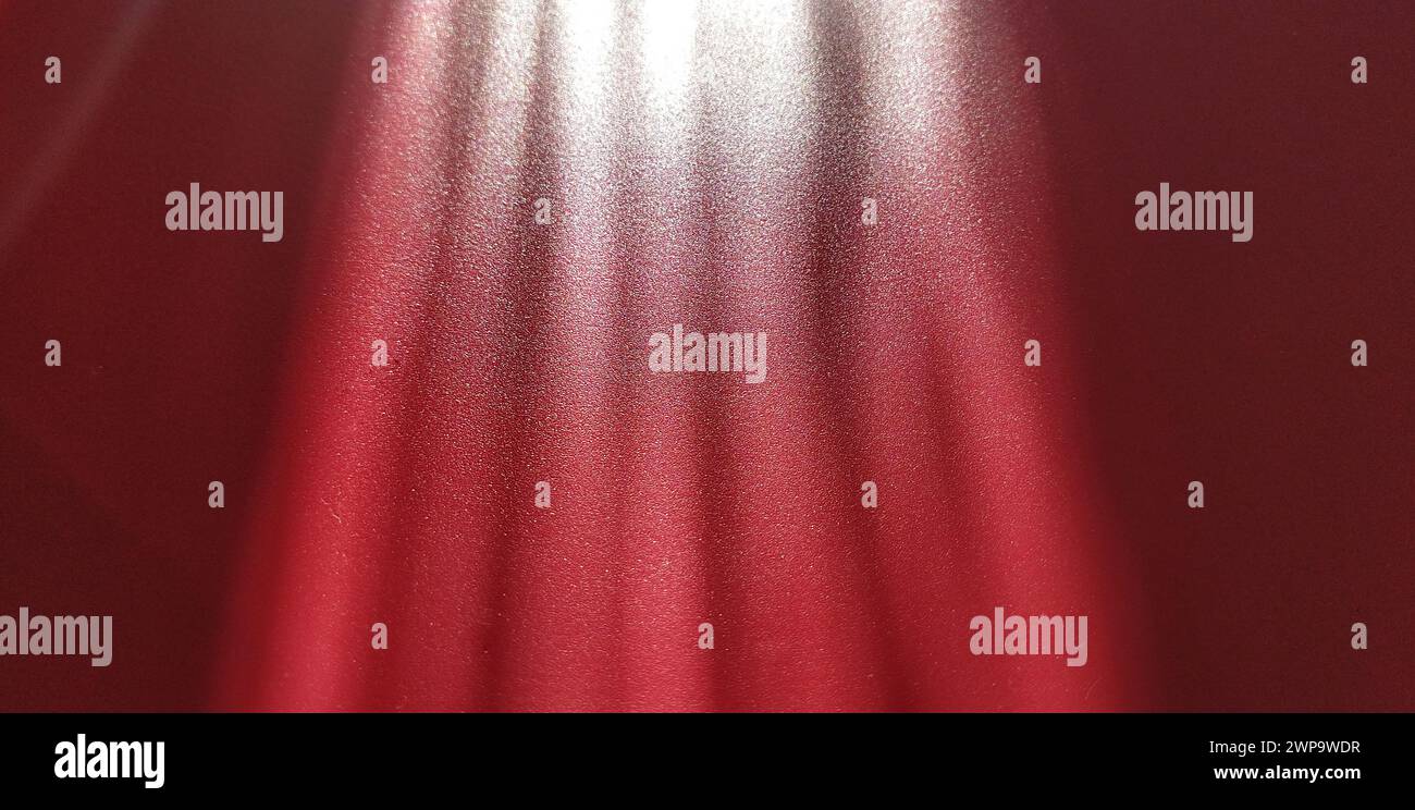 spotlights and rays from above on a red background. Rays on a red ...