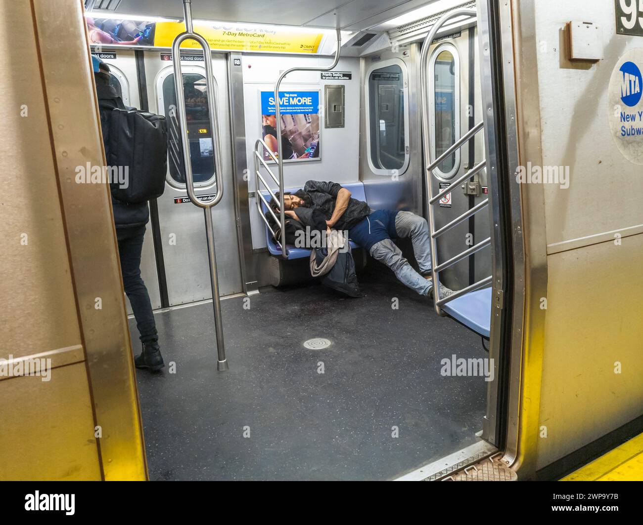 Homeless man sleeping in subway hi-res stock photography and images - Alamy
