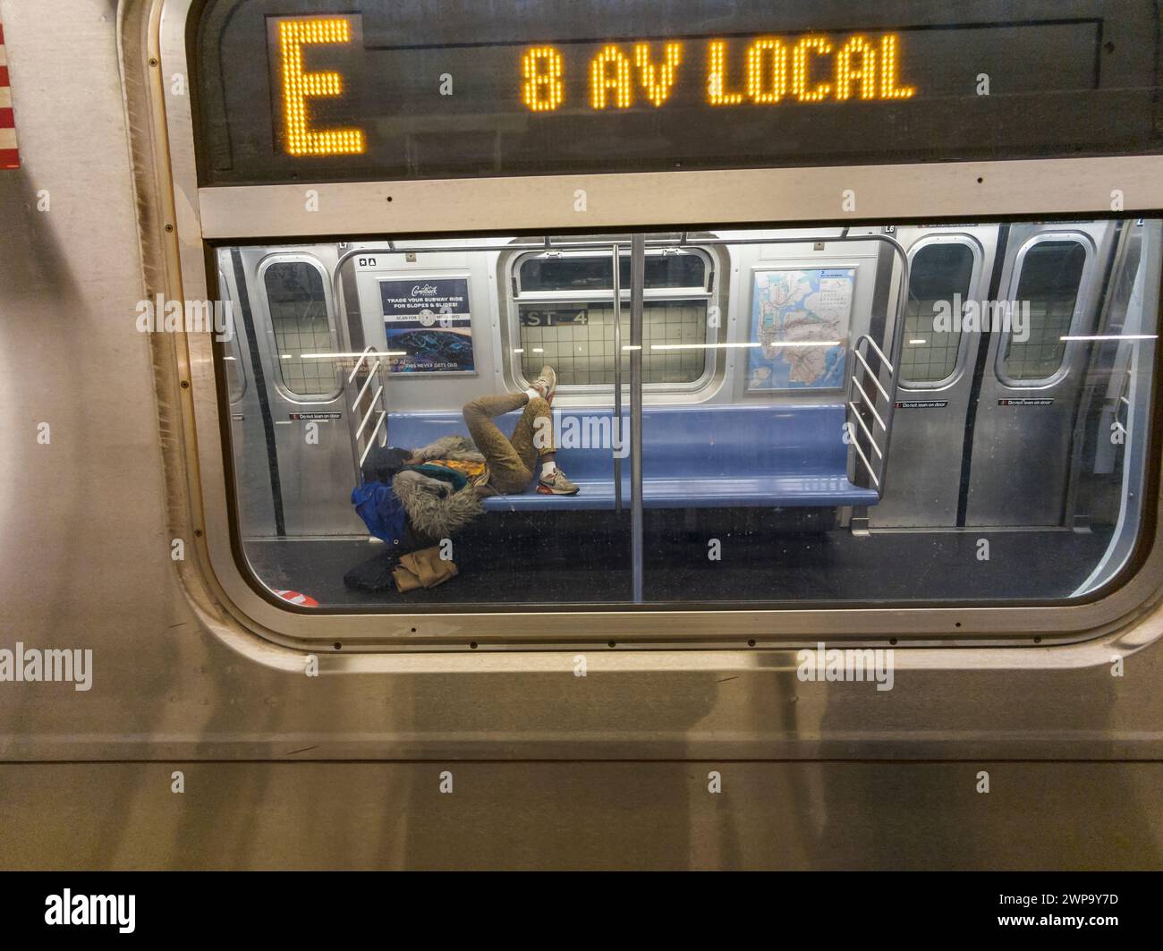 Homeless man sleeping in subway hi-res stock photography and images - Alamy