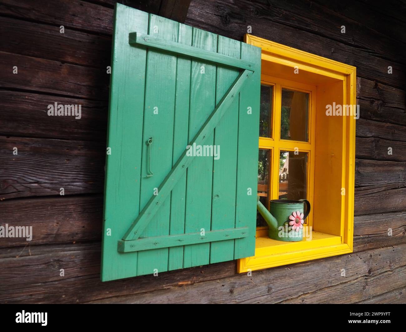 Ethno-folk wooden shutters on a window with a wooden frame, painted ...