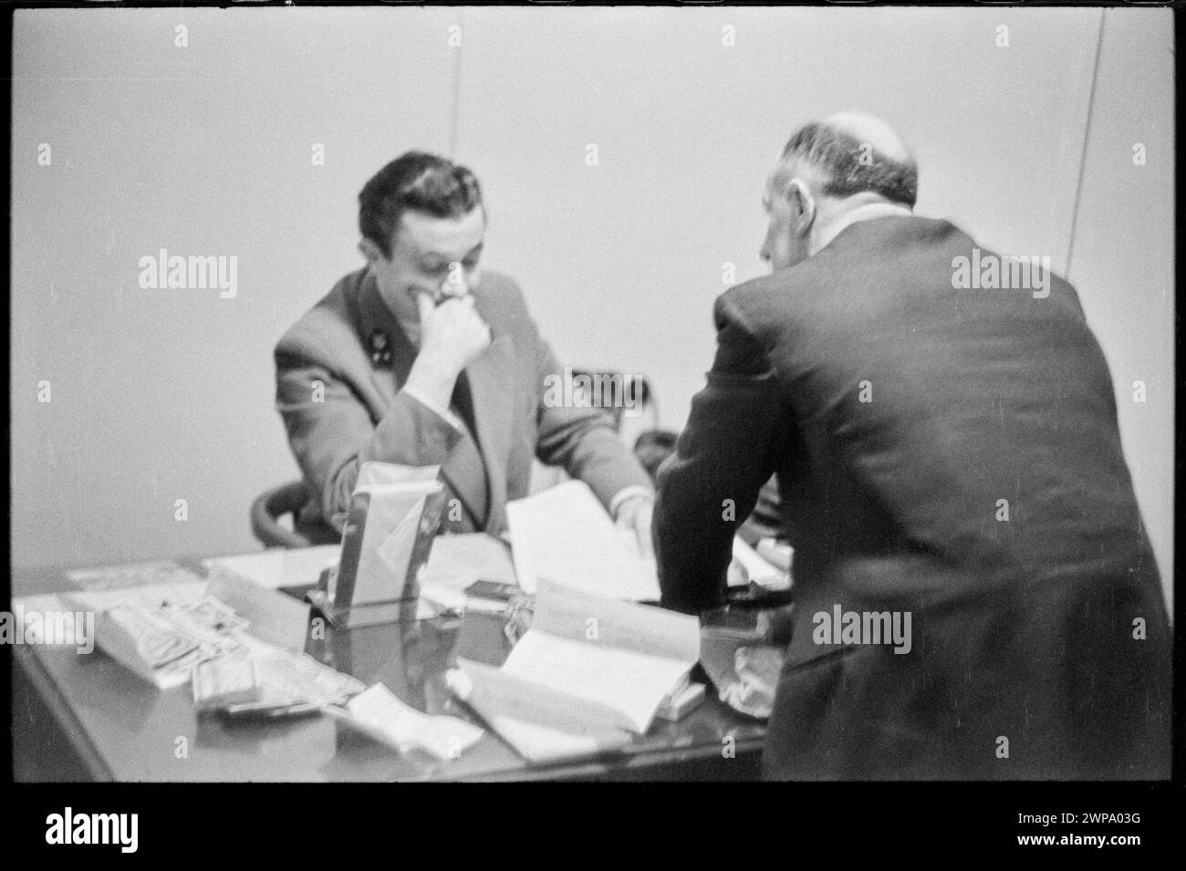 Customs officer performing passport Black and White Stock Photos ...