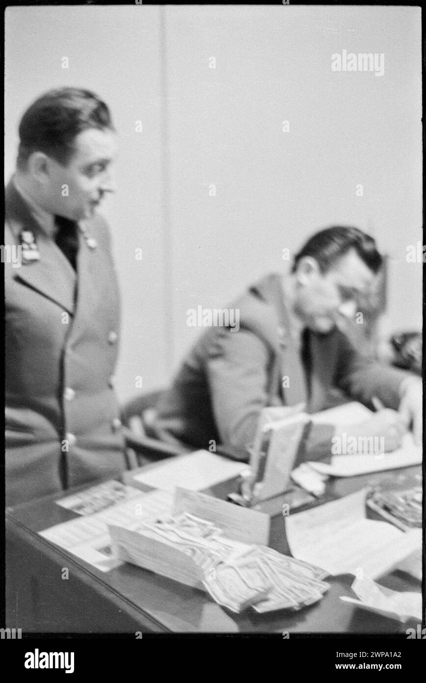 Customs officers at Warsaw Airport foreign station in 1959 performing ...