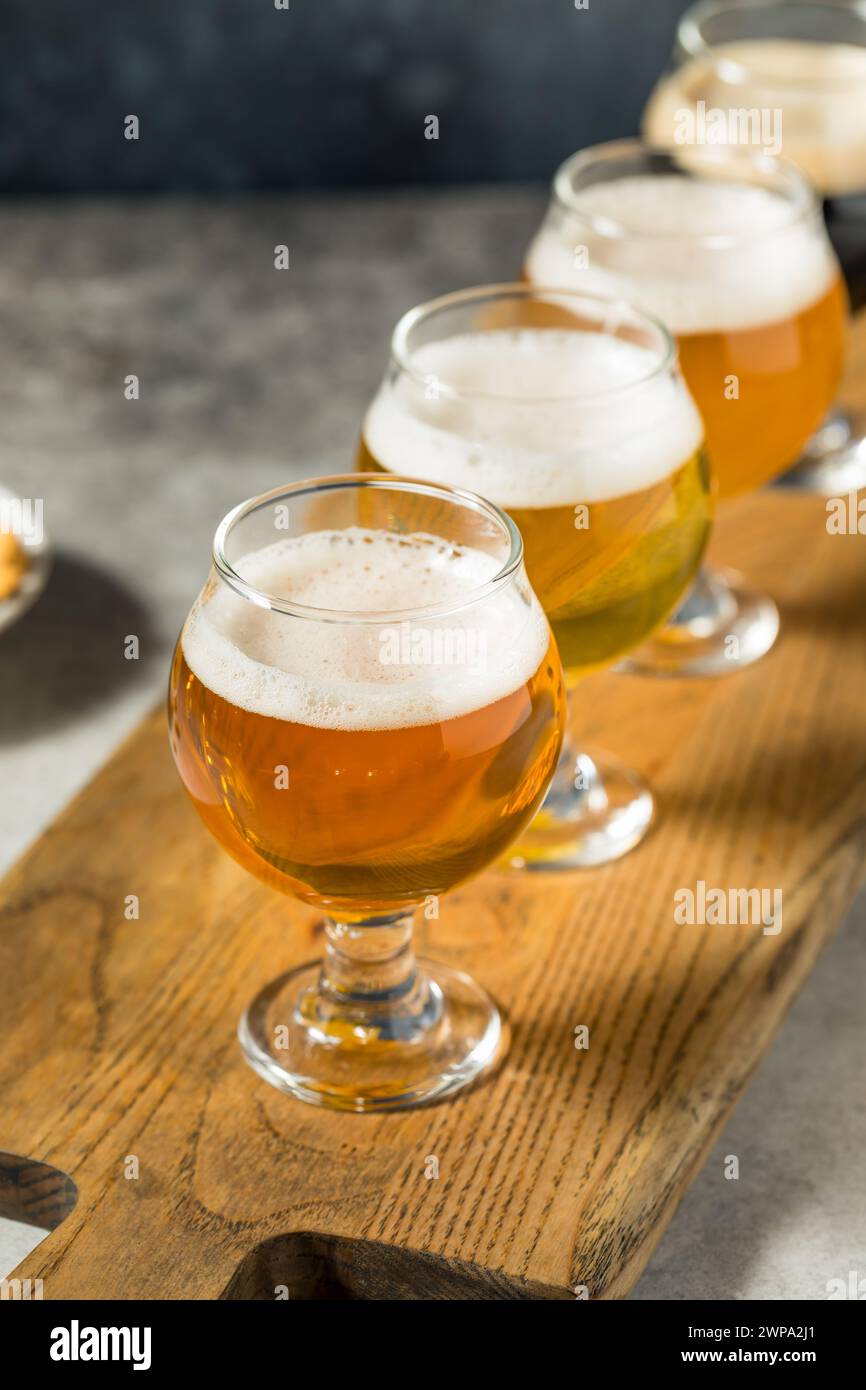 Boozy Cold Refreshing Craft Beer Flight with Peanuts Stock Photo - Alamy