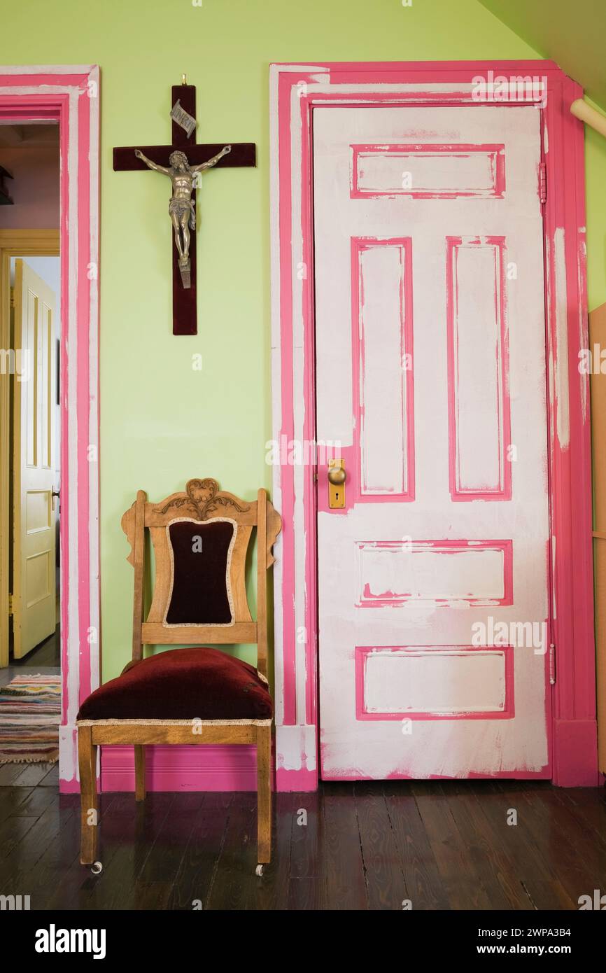 Eastlake chair with velvet seat in room with unfinished painted closet ...