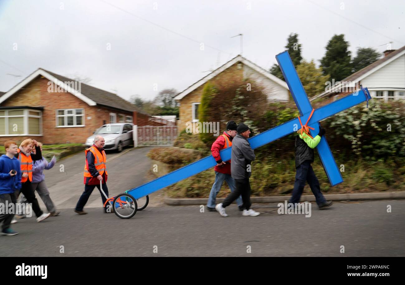 08/03/14 To mark Lent worshippers drag an 18 ft cross over 18 miles ...