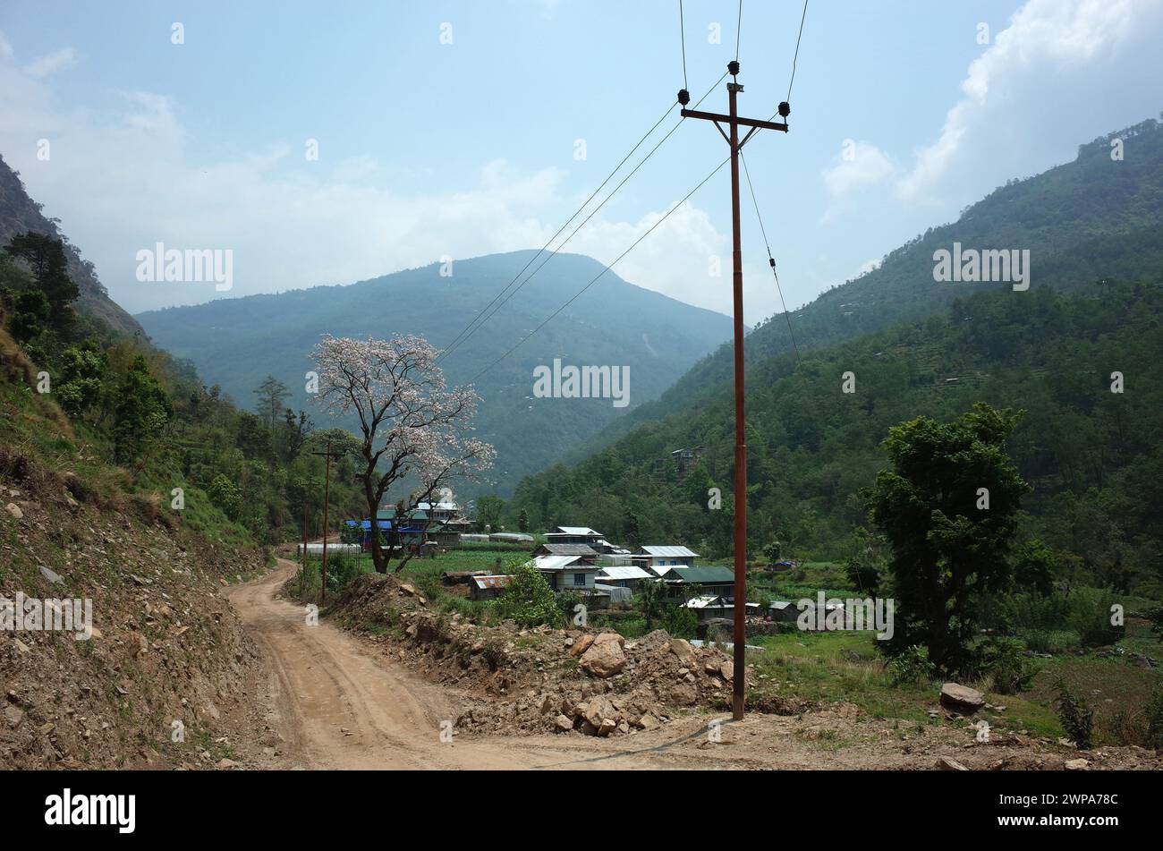 Pole with electric wires to Kinja village in Nepal Himalayas. Lower ...