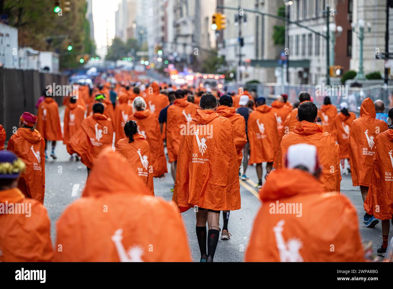 Finisher runners with thermal blankets having just finished the ...