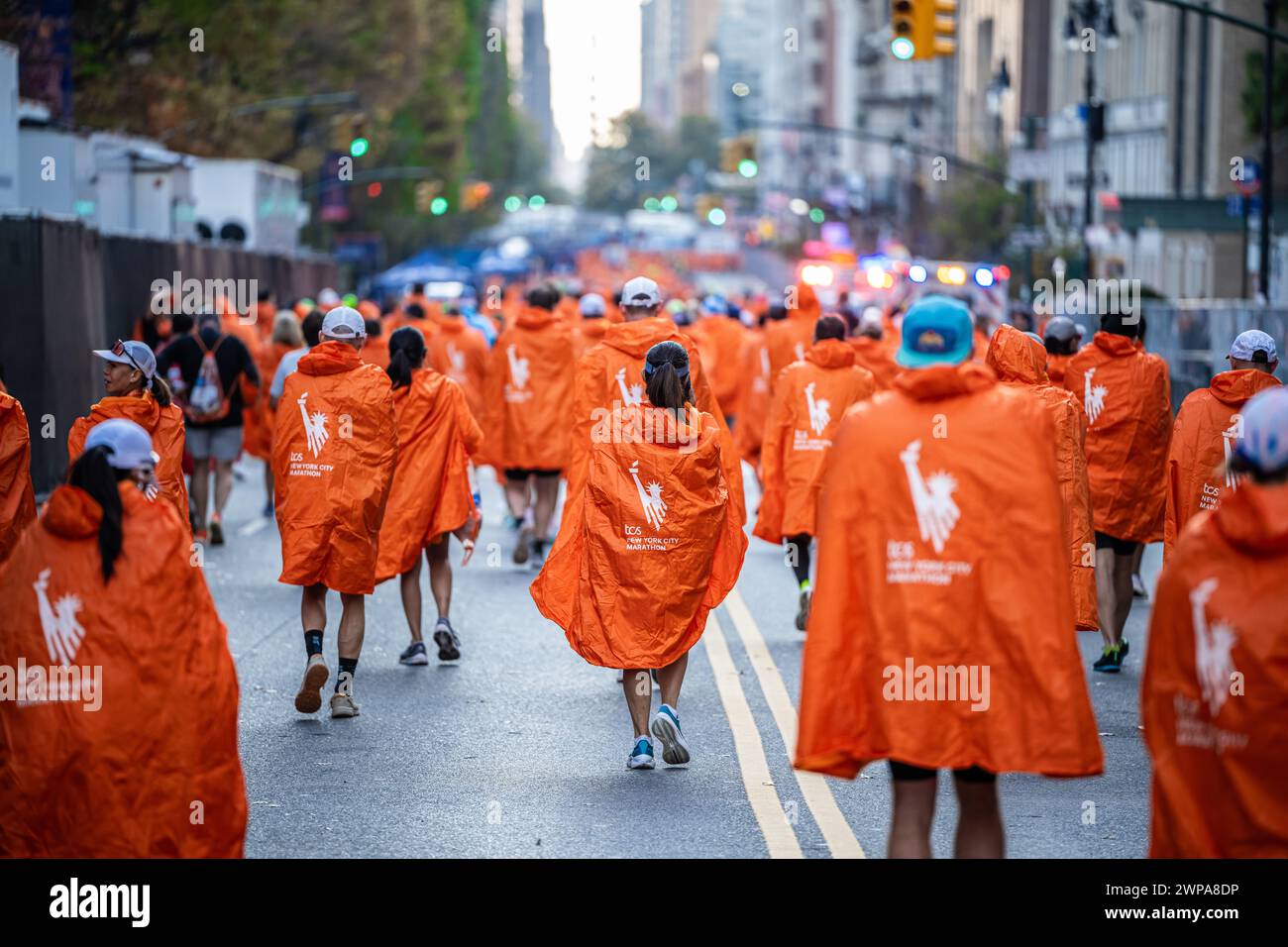 Finisher runners with thermal blankets having just finished the ...