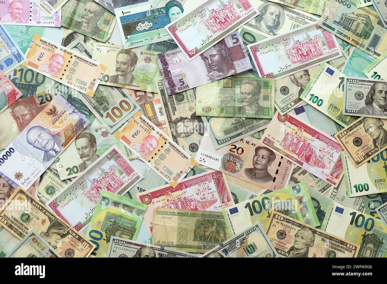 Many banknotes of different currency. Background of big amount of ...