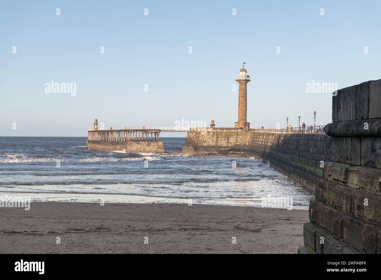 West Pier harbour wall, lighthouse, Memorial bridge and south bay Beach ...