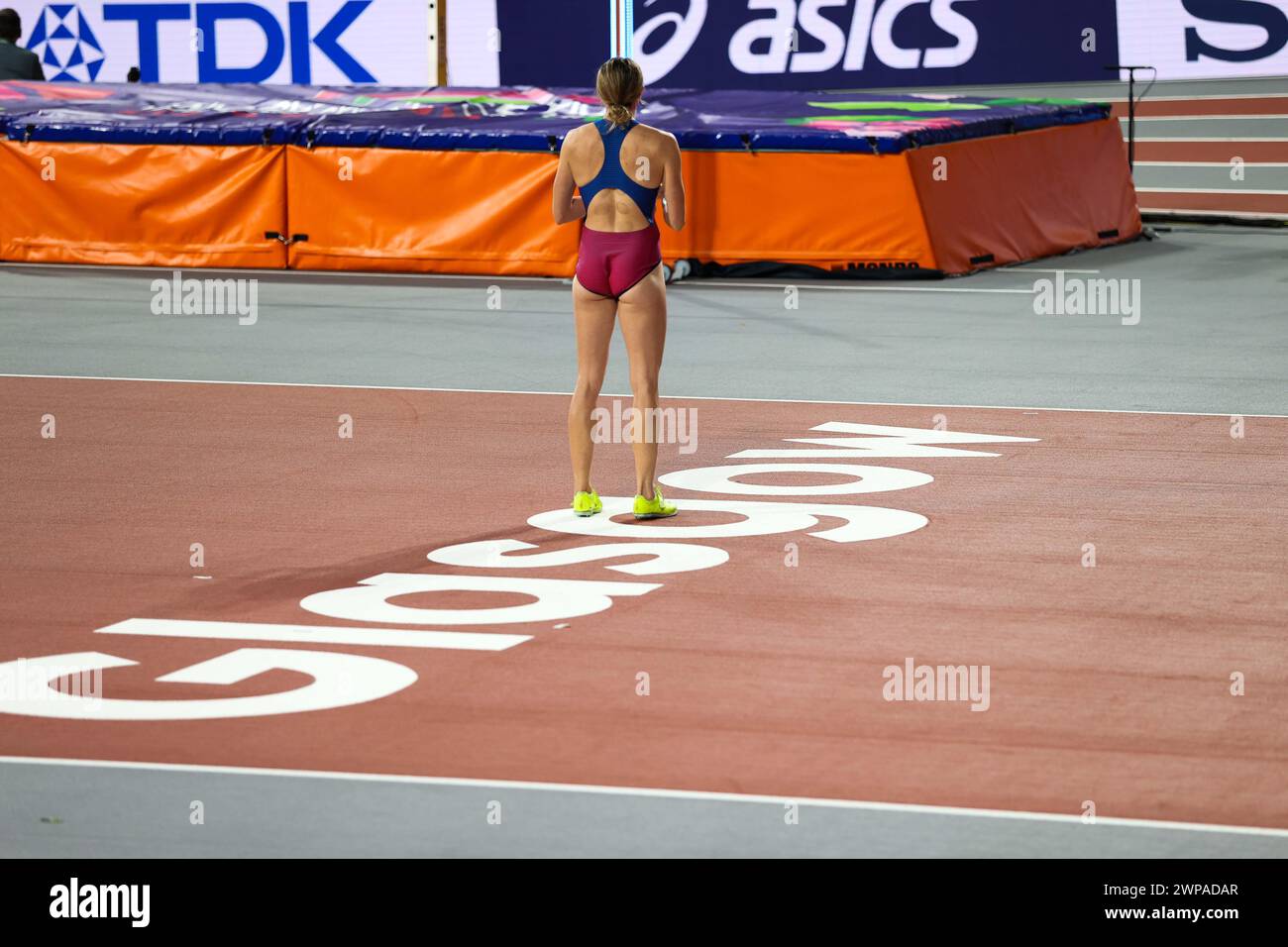 Glasgow branding visible beneath an athletes feet as the High Jump ...