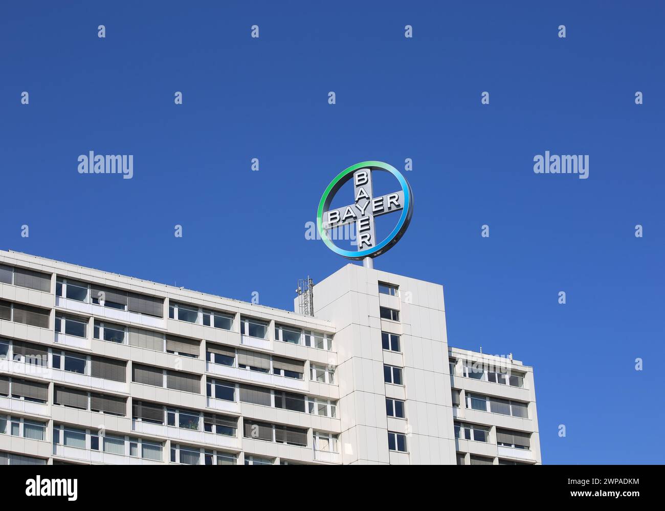 BERLIN, GERMANY-FEBRUARY 27,2015: Bayer AG building with spinning logo ...