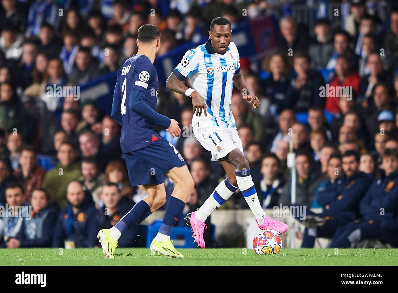Sheraldo Becker of Real Sociedad compete for the ball with Achraf ...