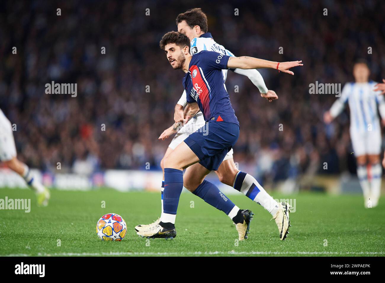 Lucas Beraldo of Paris Saint-Germain compete for the ball with Mikel ...