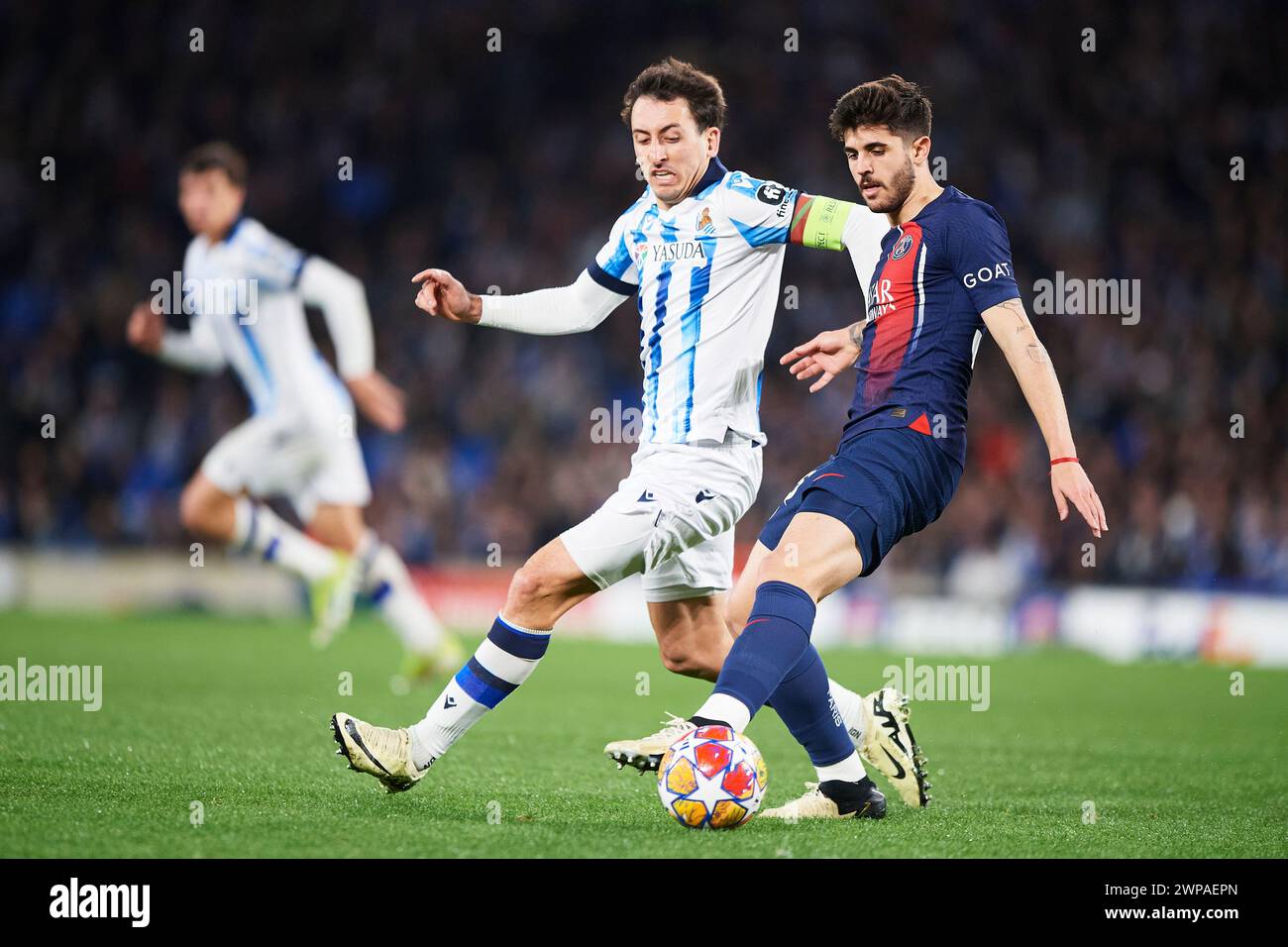 Lucas Beraldo of Paris Saint-Germain compete for the ball with Mikel ...